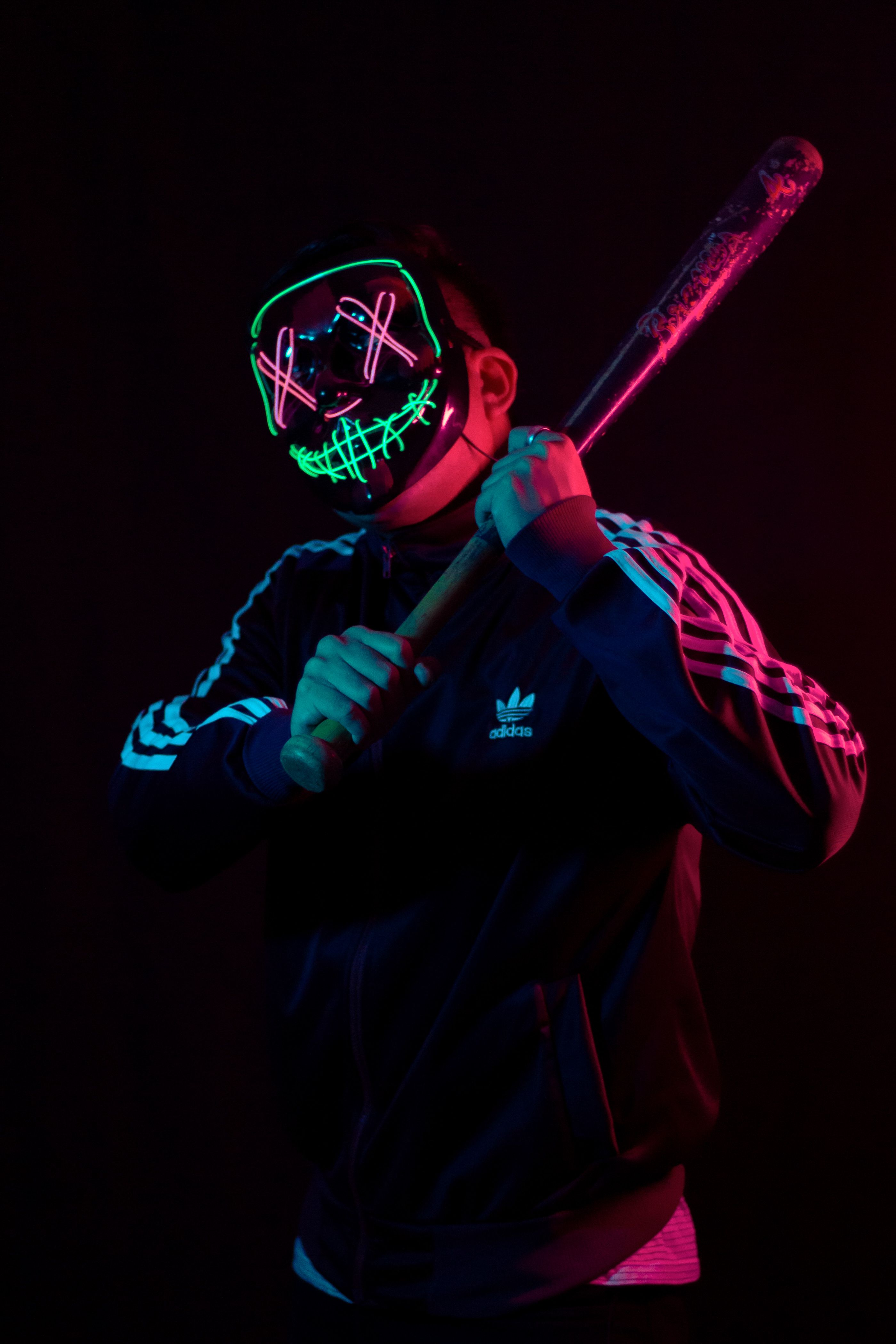 Man Wearing Neon Mask in the Dark · Free Stock Photo
