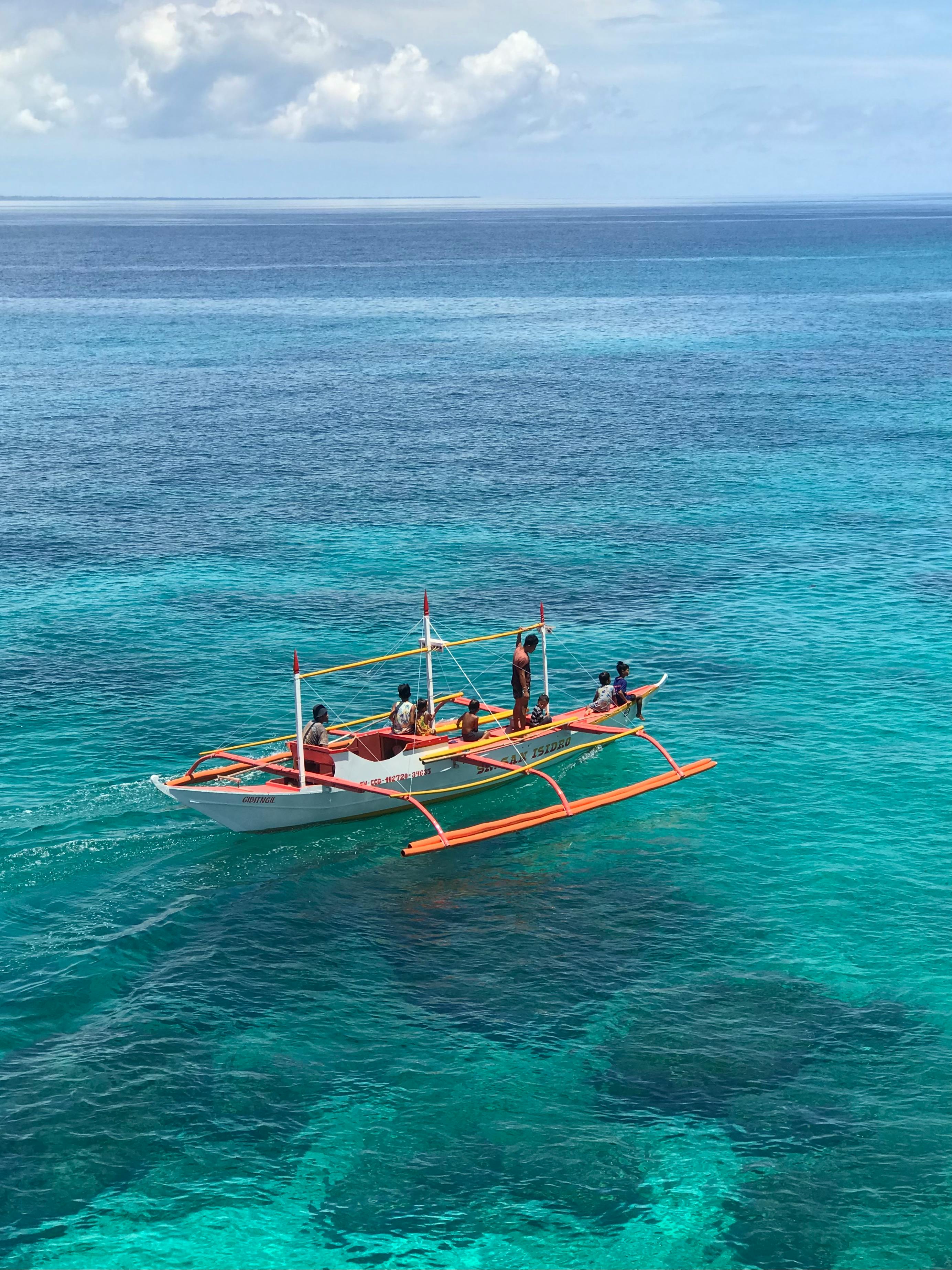 People on Boat in Blue Ocean · Free Stock Photo