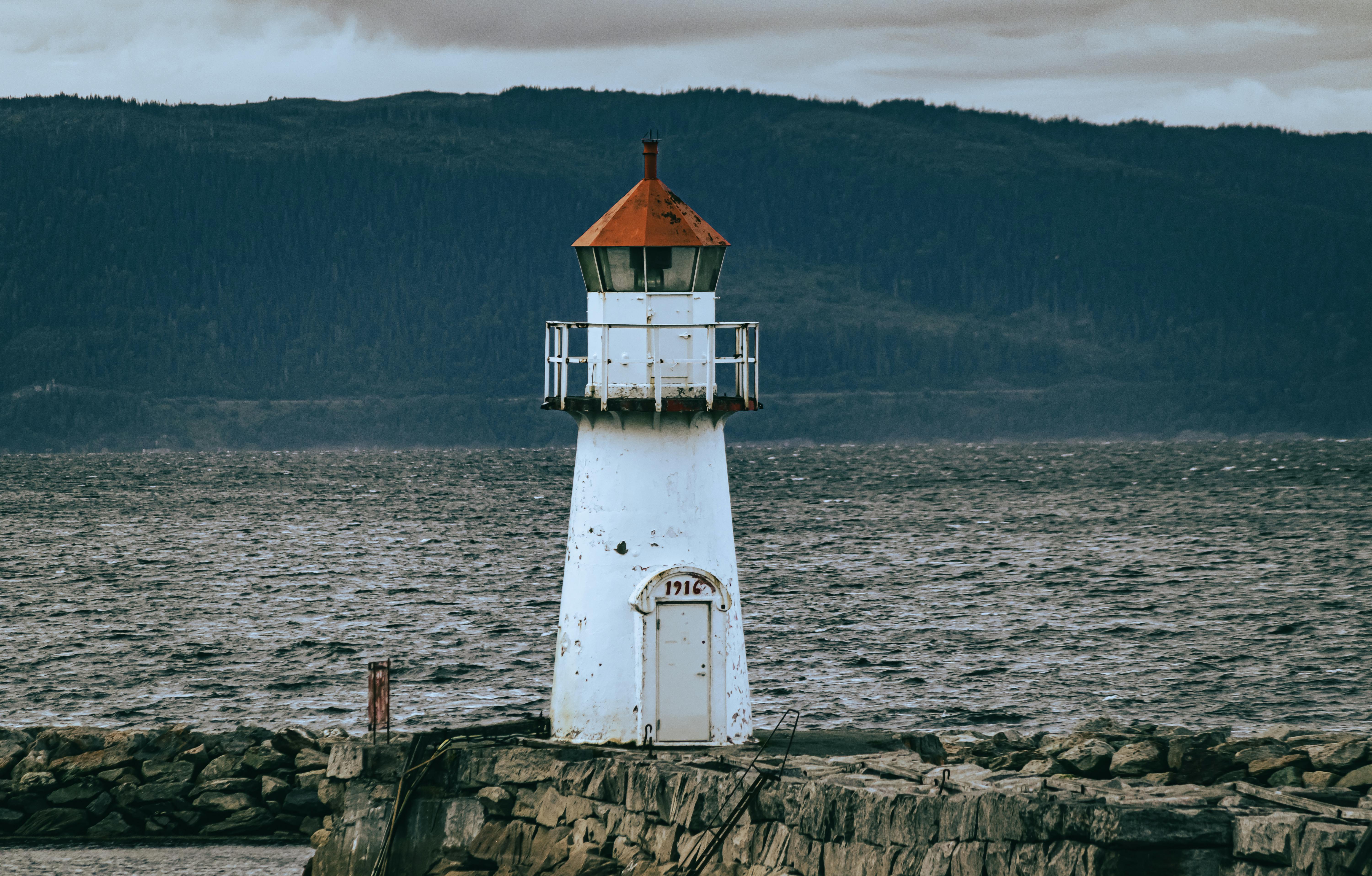 Lighthouse on Rocks in Port · Free Stock Photo
