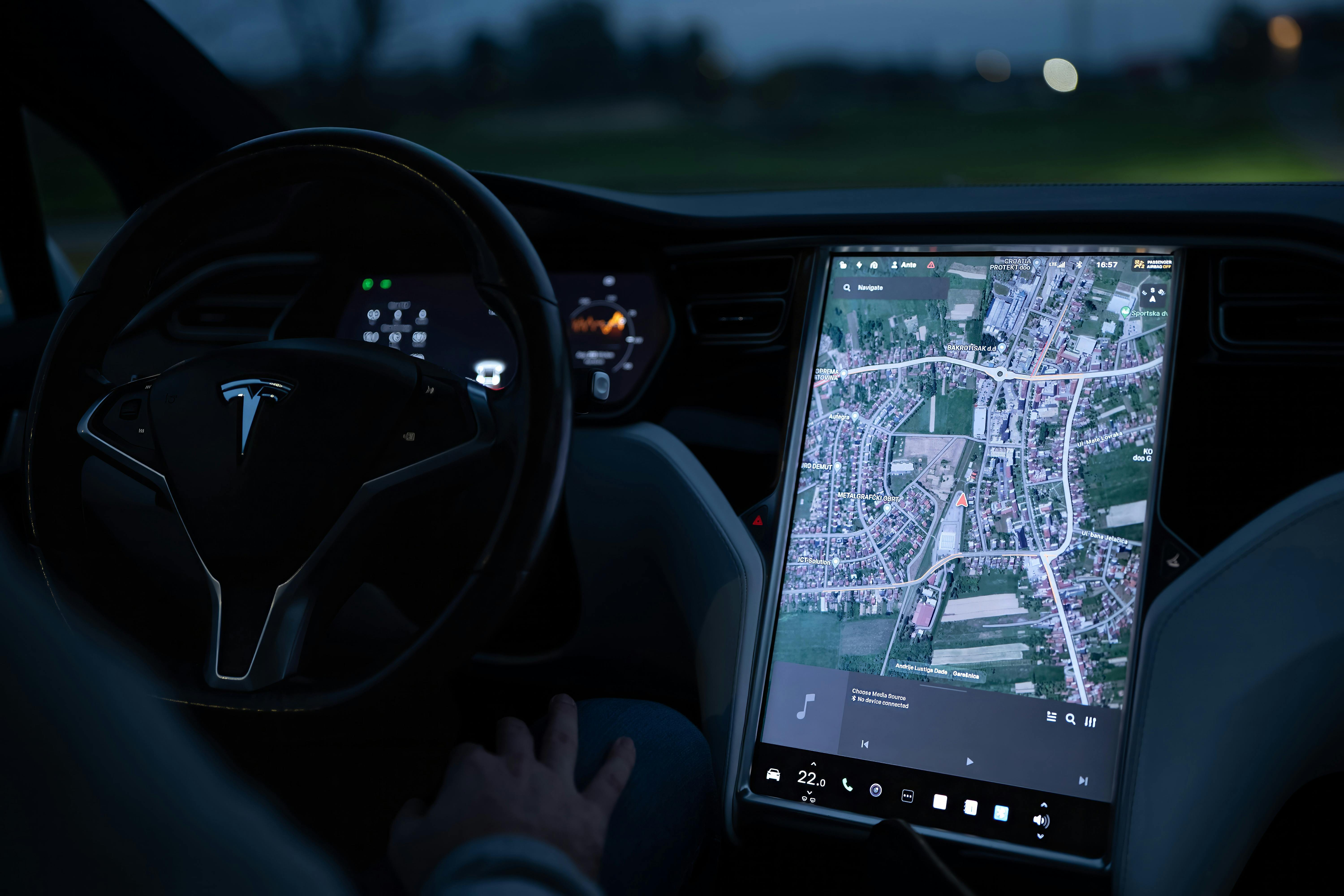 View of a Tablet Showing the Map in a Tesla · Free Stock Photo