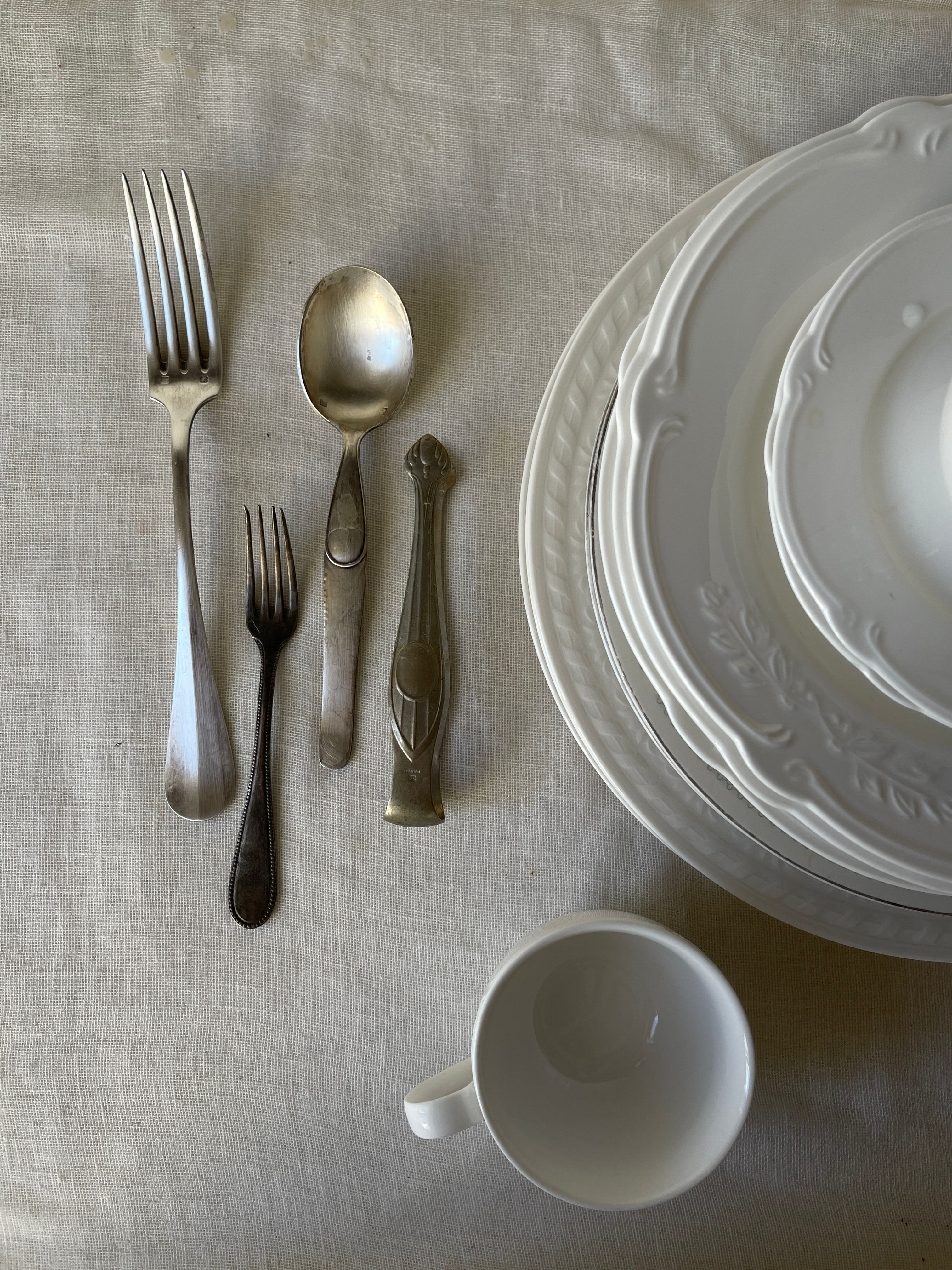 Vintage Cutlery and Tableware on a Table · Free Stock Photo