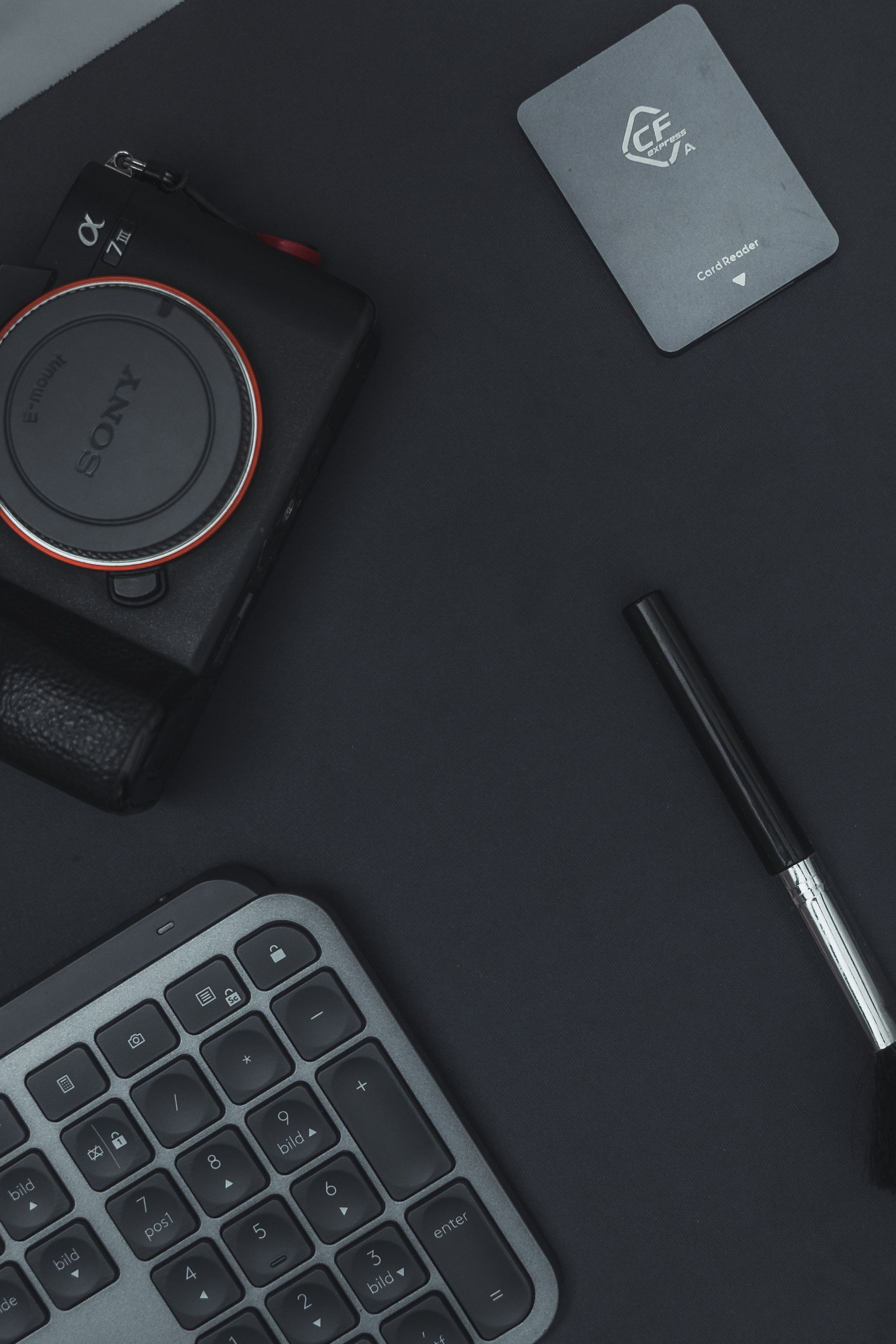 Top View of a Camera and Keyboard on the Desk · Free Stock Photo