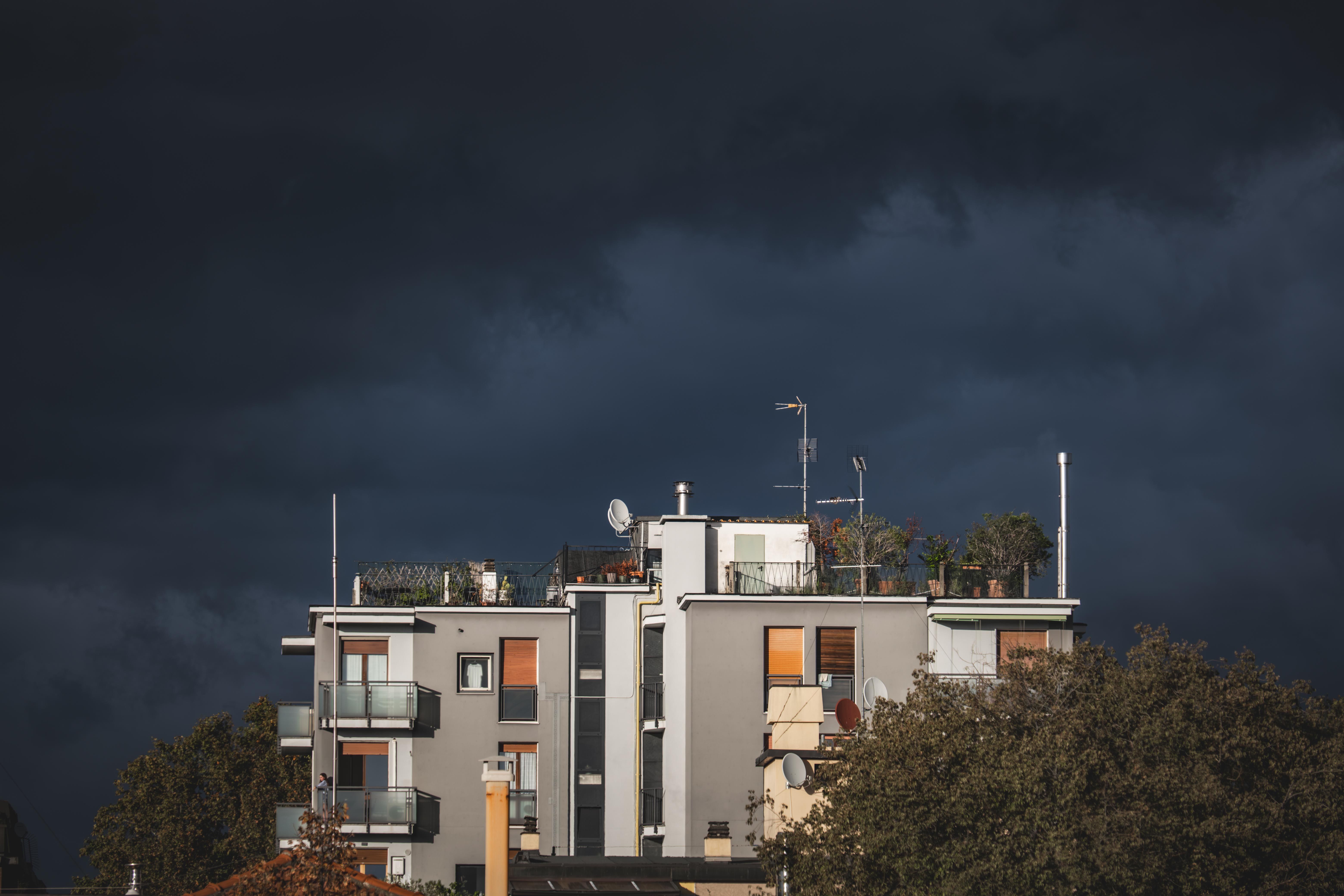 Dark Storm Cloud Over the Apartment Building · Free Stock Photo