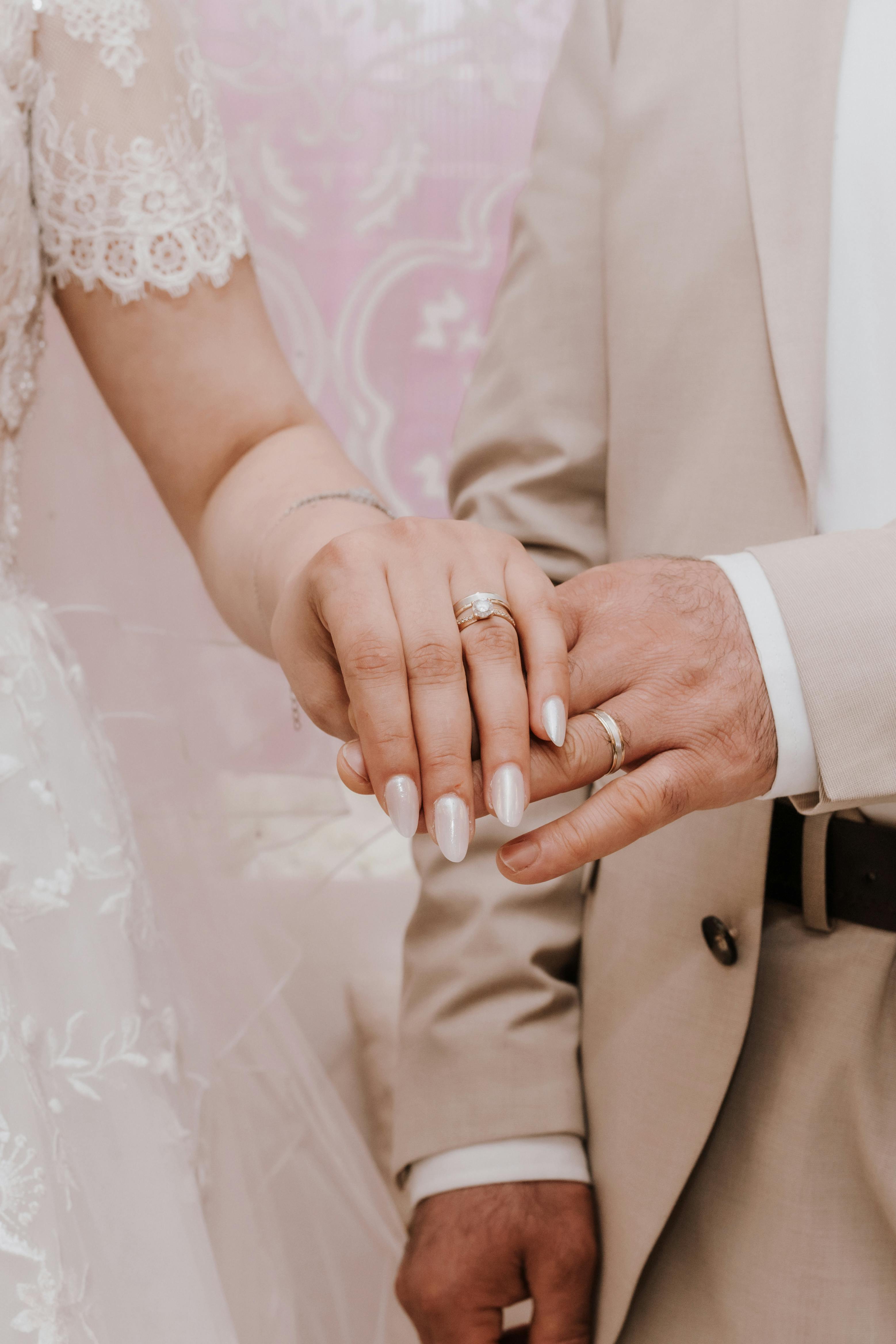 Newlywed Couple Touching Hands · Free Stock Photo