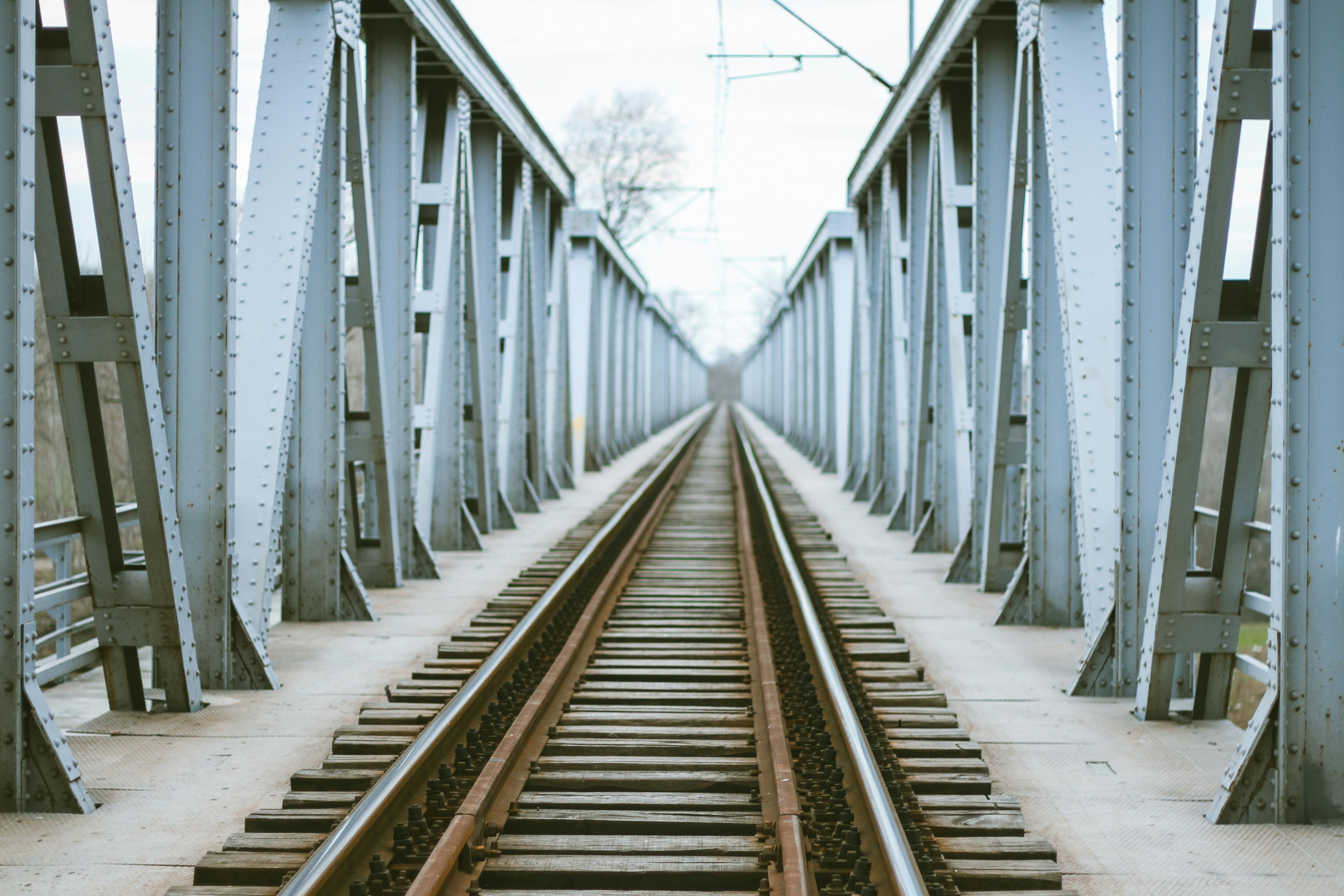 Train Track Bridge during Cloudy Skies · Free Stock Photo