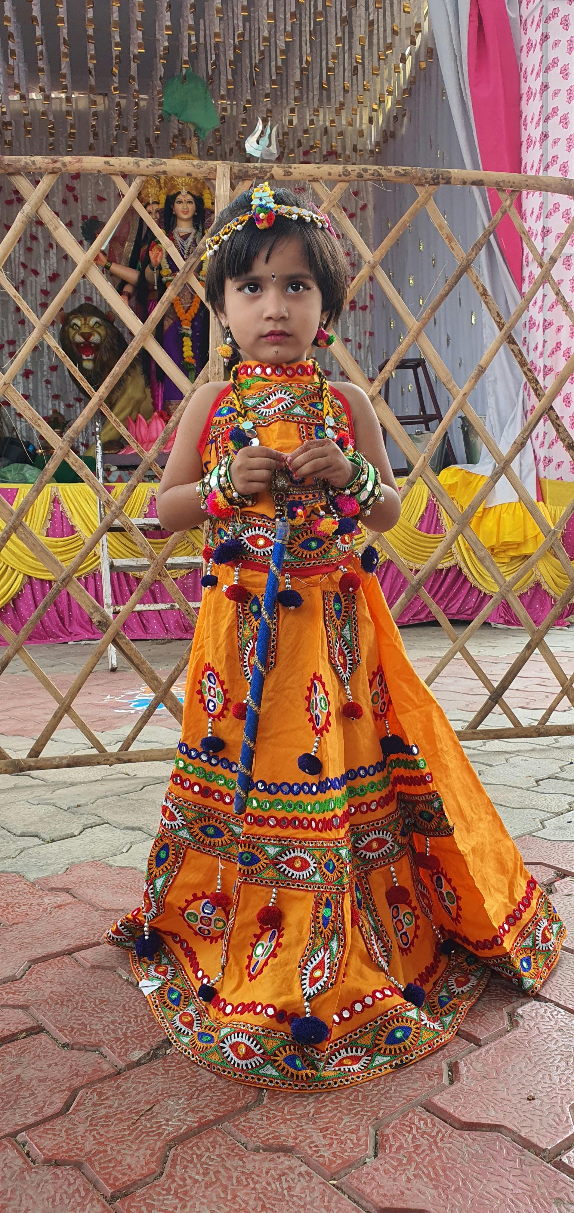 Girl in Traditional Clothing Fixing the Garland on Her Neck · Free ...