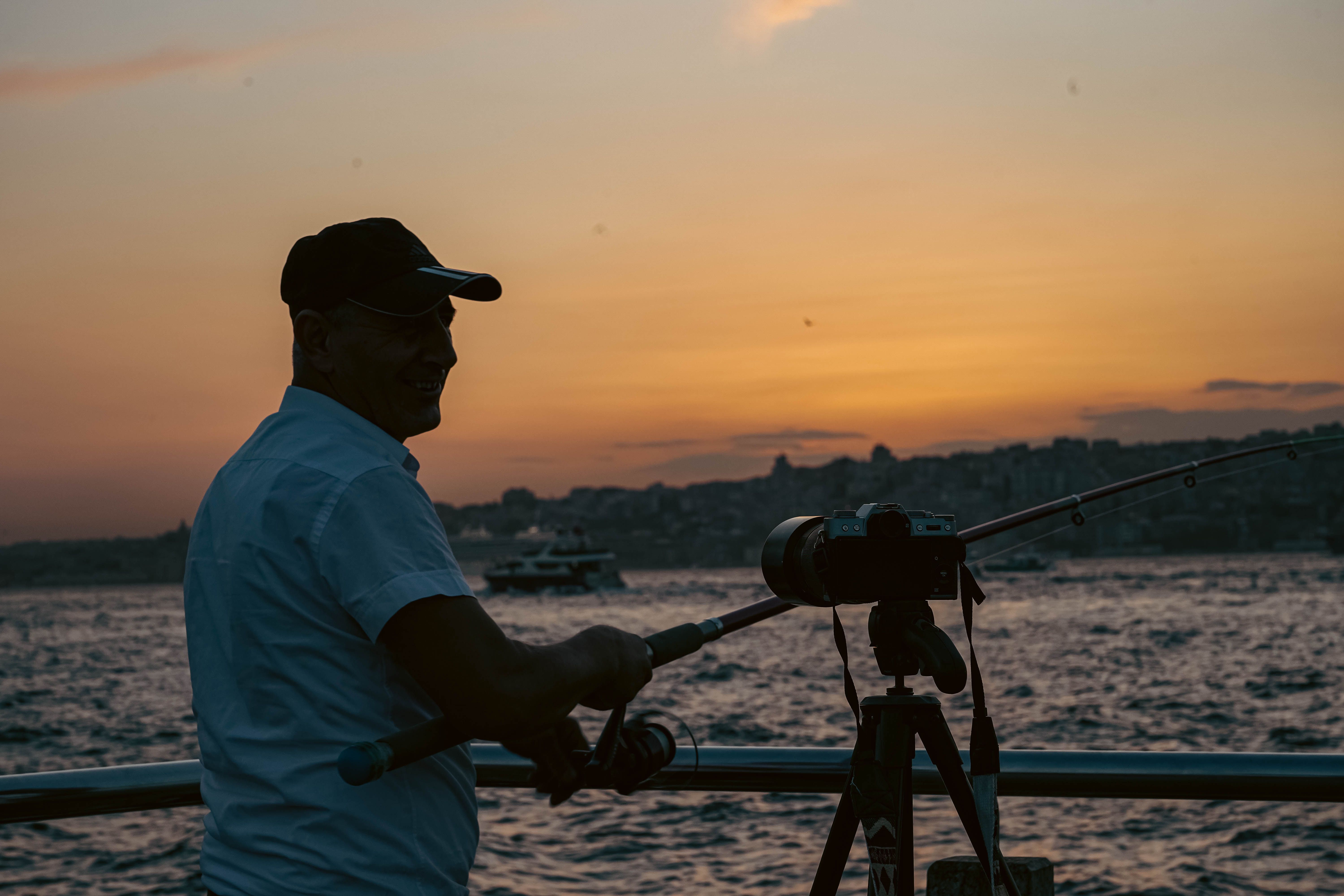 Fisherman on Sea Shore at Sunset · Free Stock Photo
