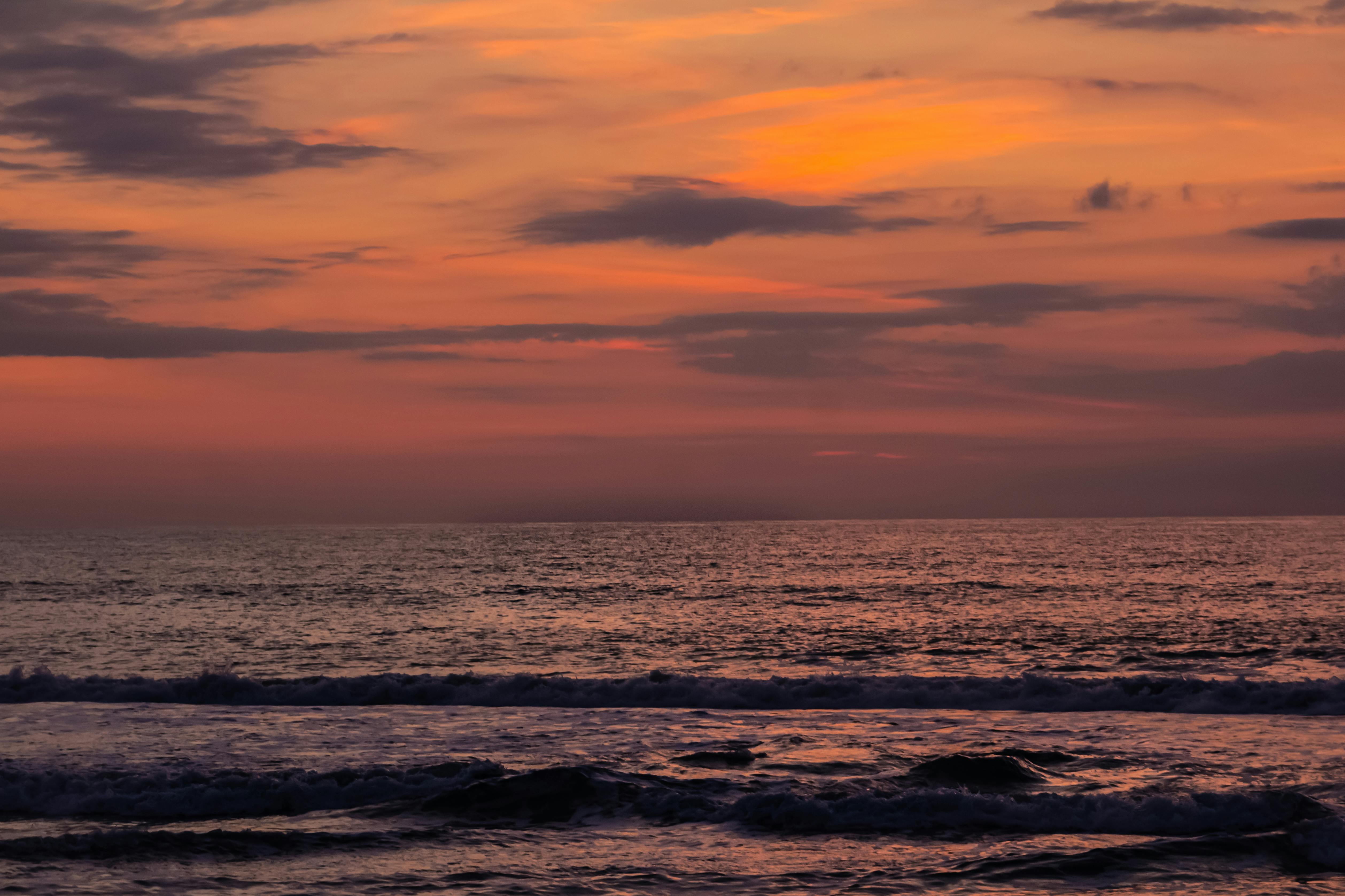 Seascape of a Turquoise Water Under a Pink Sunset Sky · Free Stock Photo