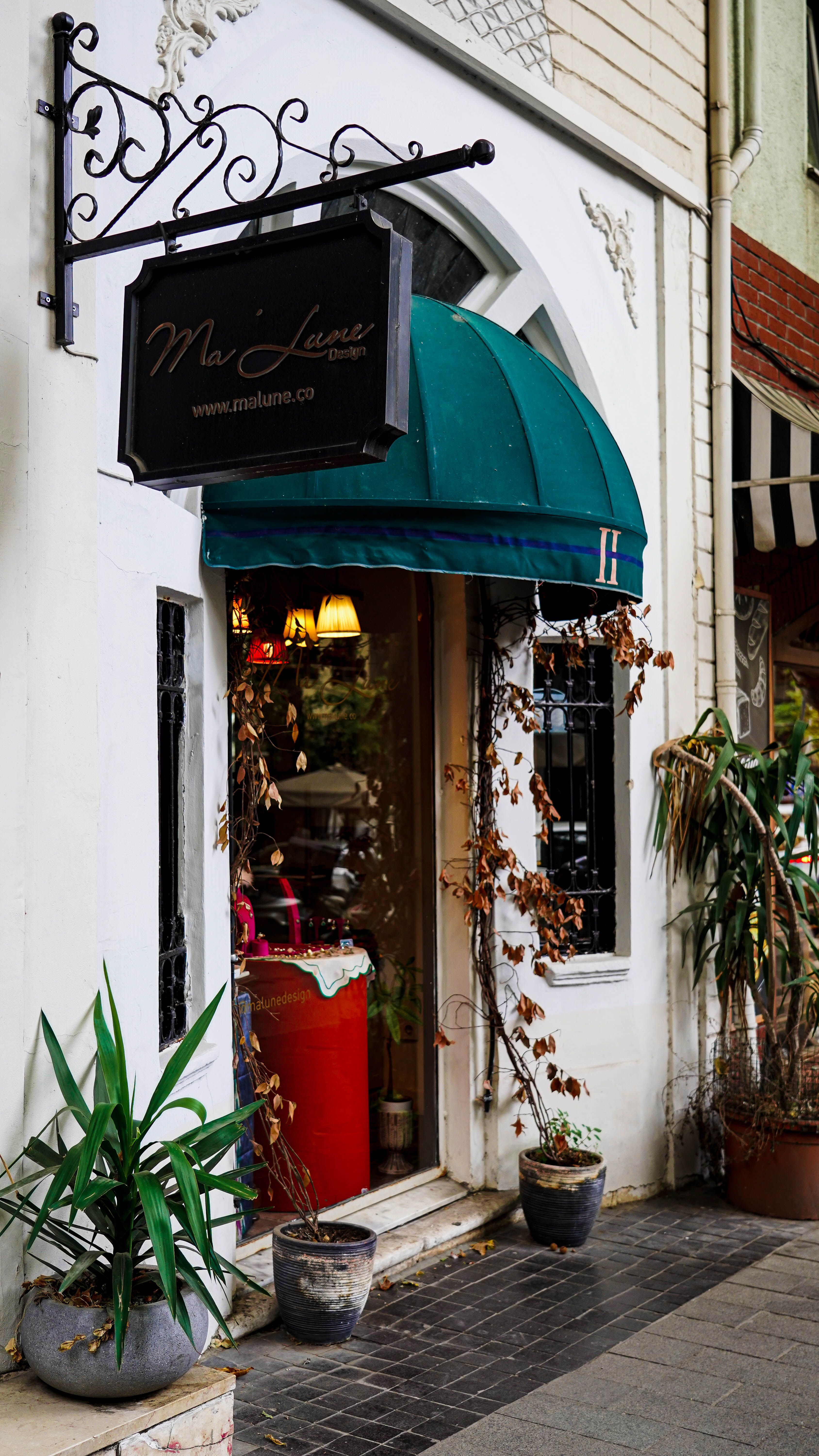 Entrance to a Cafe with Awning above the Door · Free Stock Photo