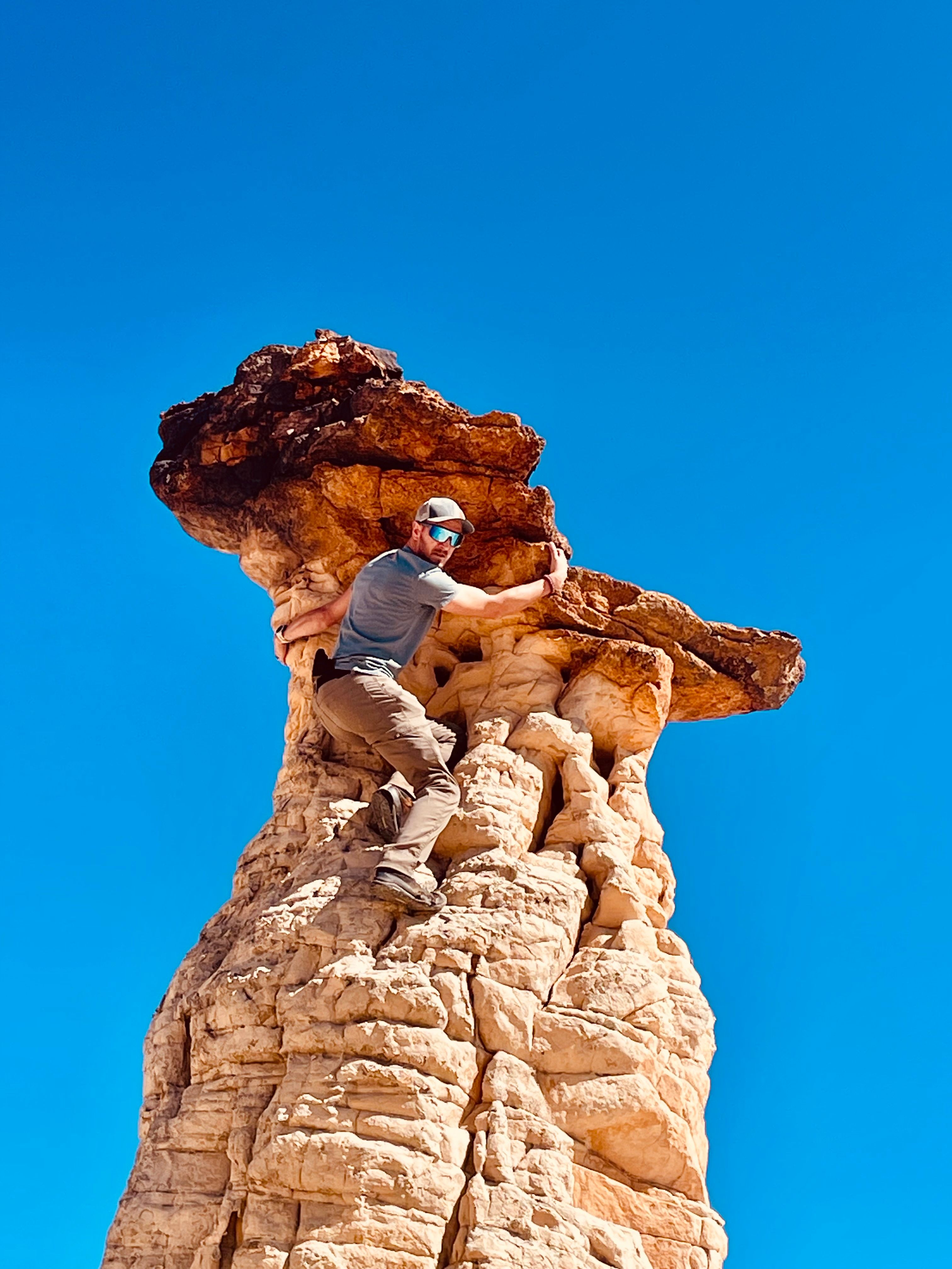Man Climbing Rock Formation · Free Stock Photo