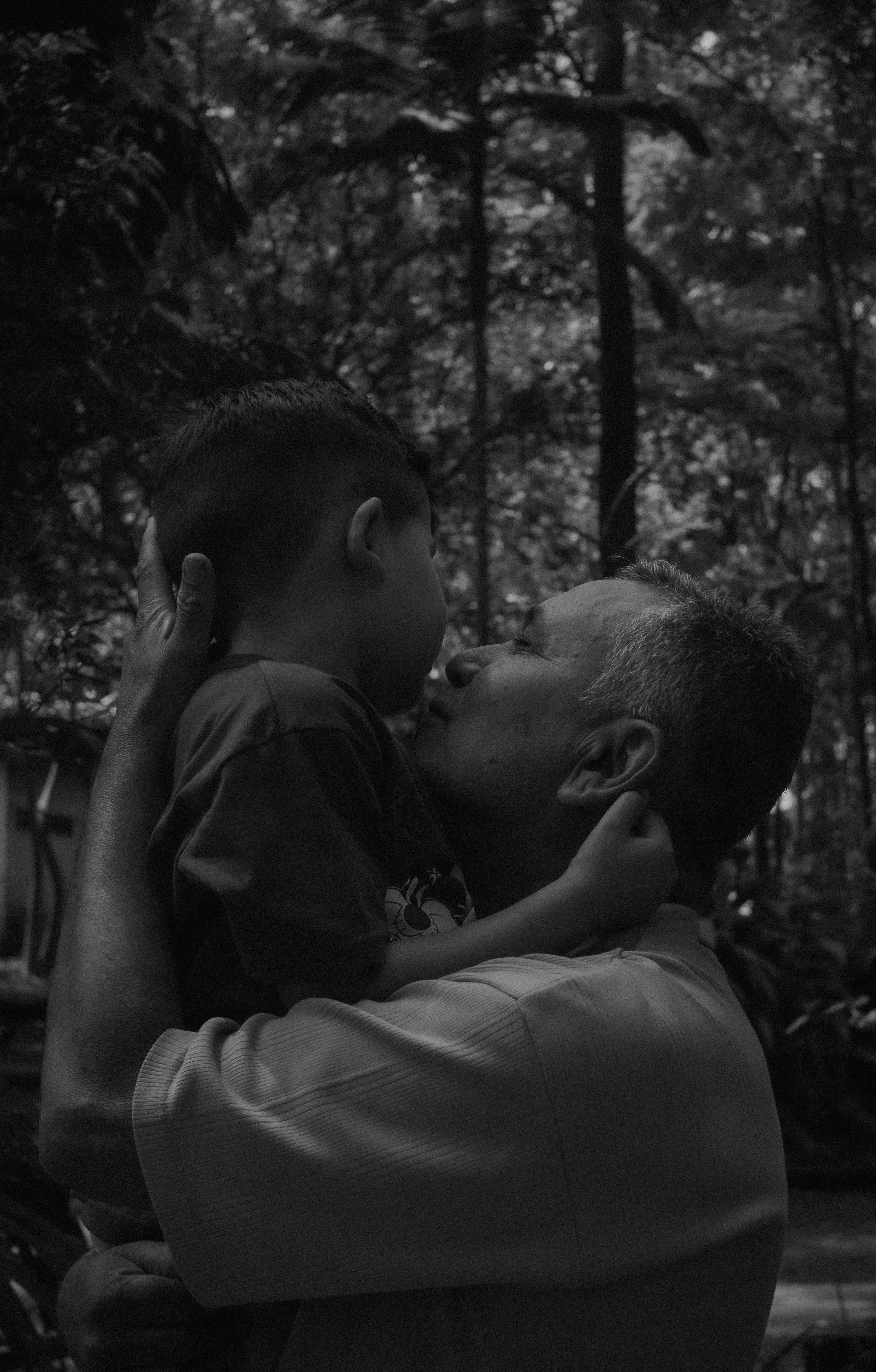 Smiling Father Holding Son · Free Stock Photo