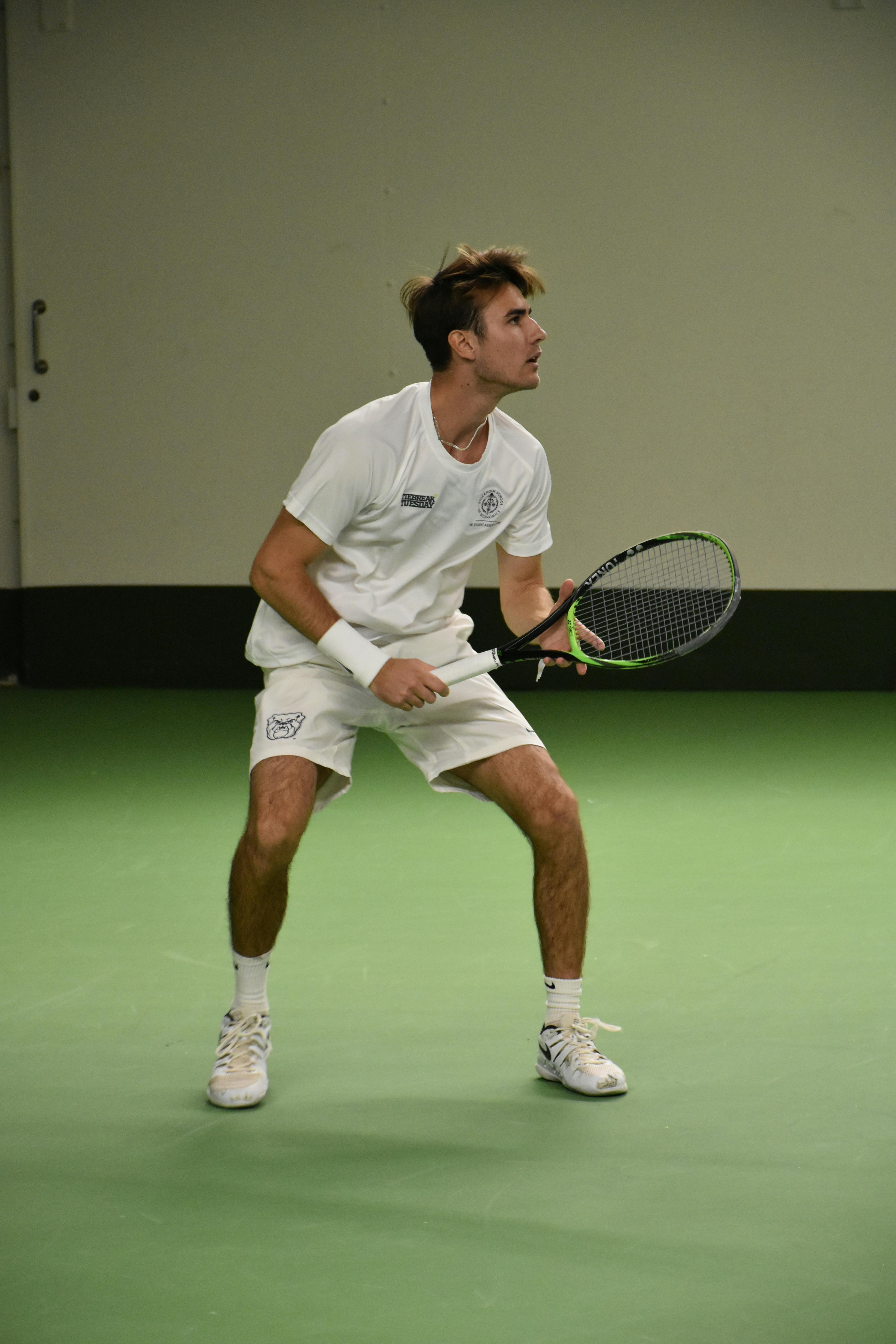 Young Man in Sportswear Playing Tennis with Racket · Free Stock Photo