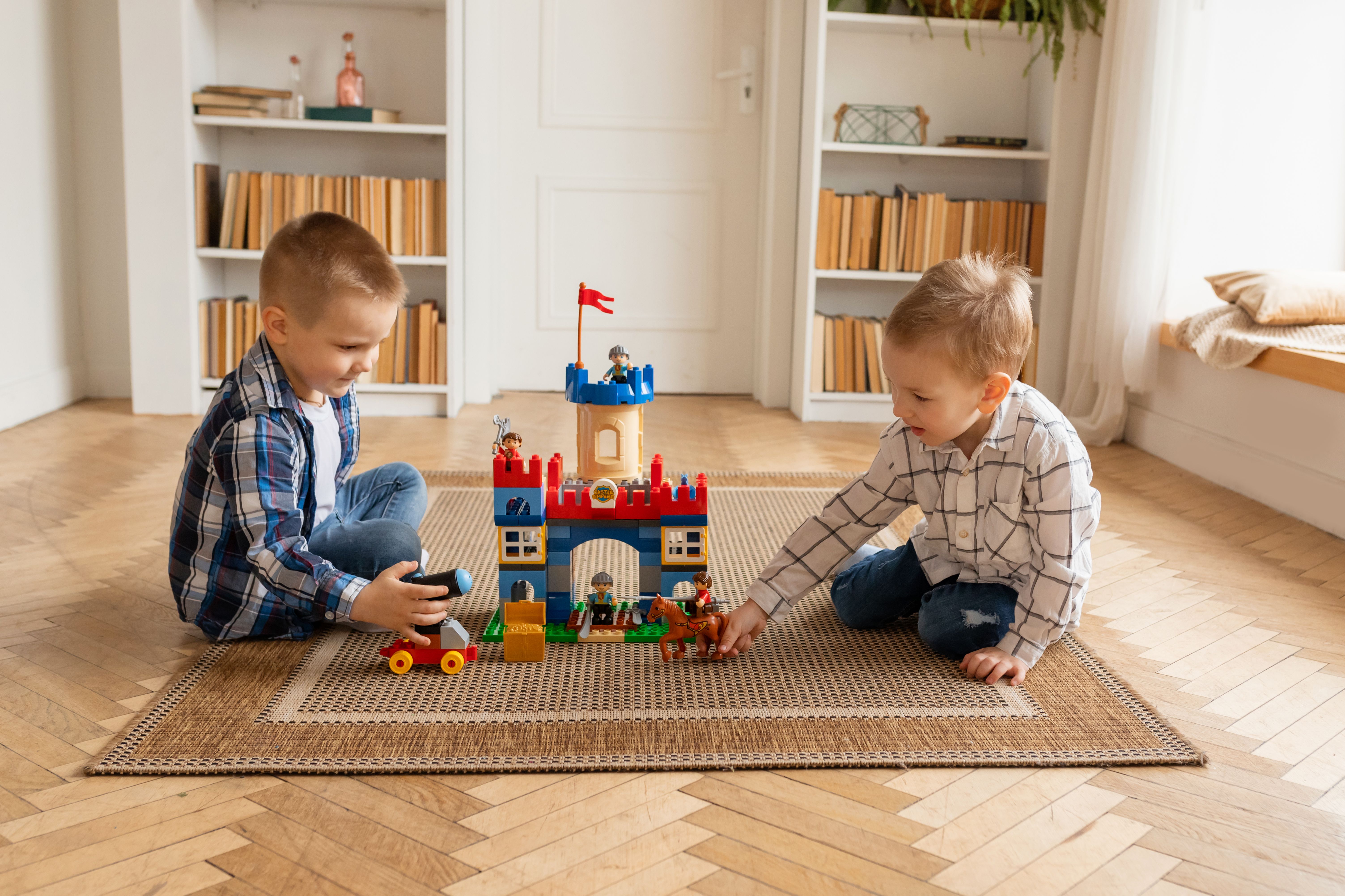 Two Little Boys Playing with Blocks · Free Stock Photo