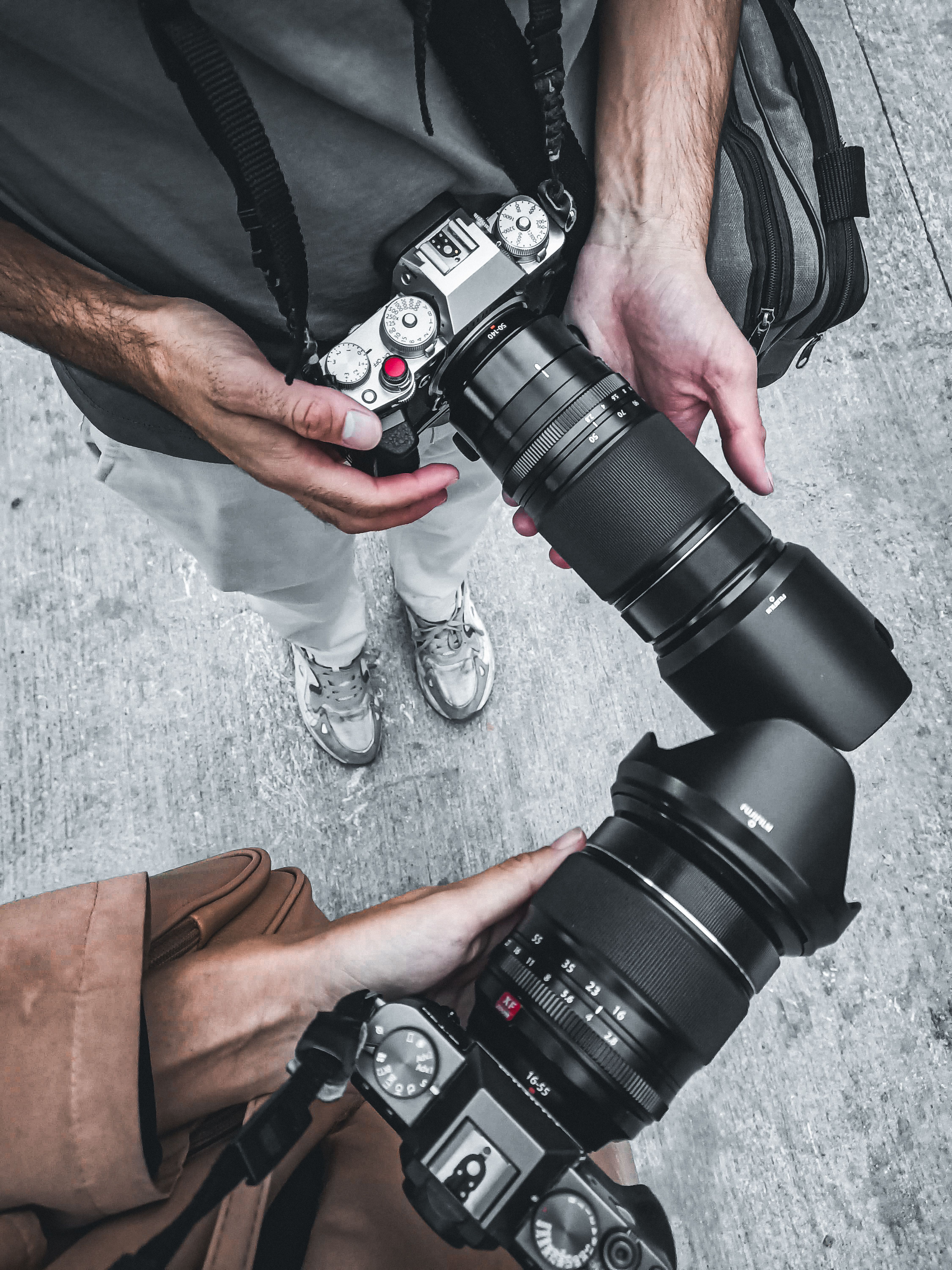 Man and Woman Holding Cameras · Free Stock Photo