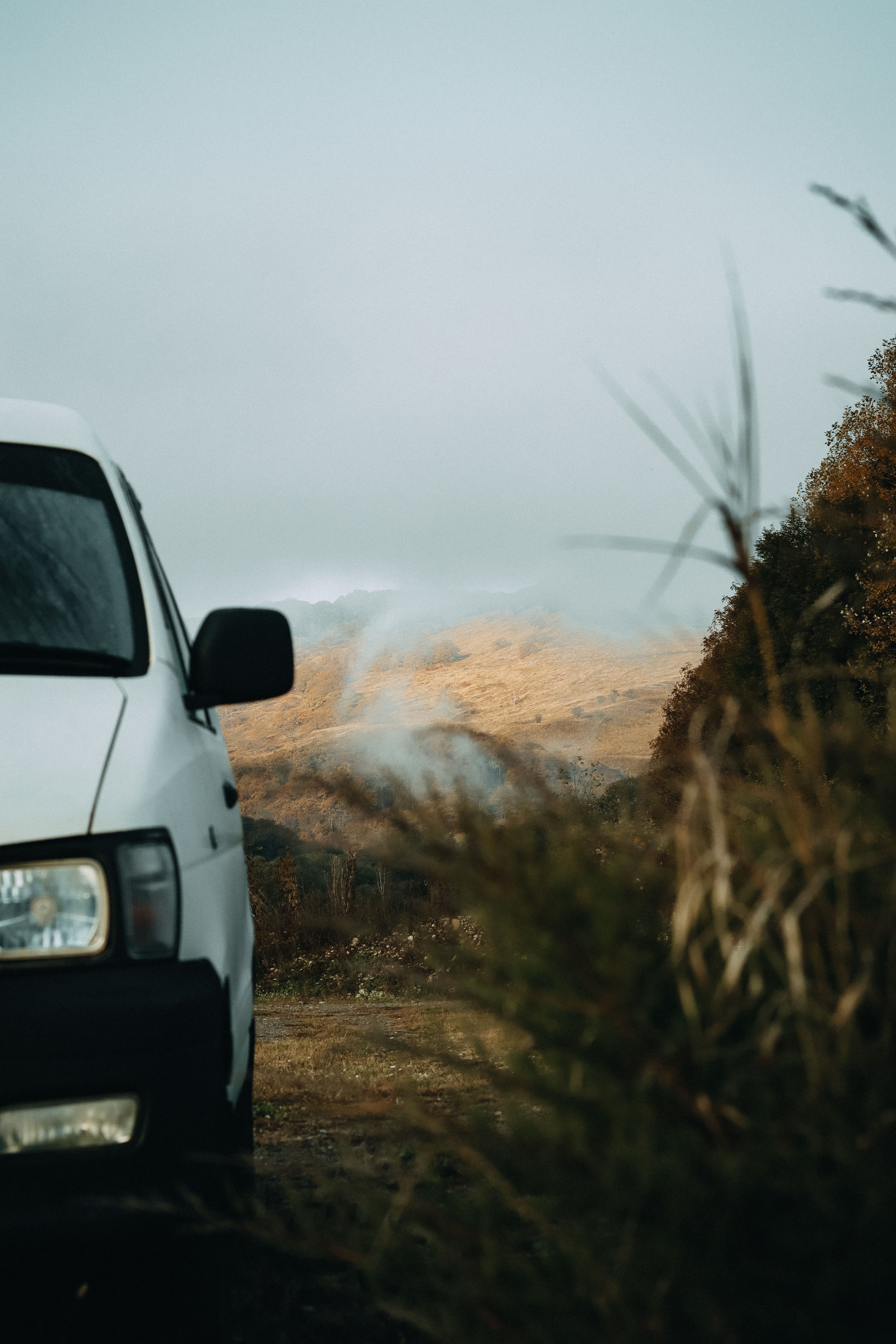 A Car Parked on a Grass Field · Free Stock Photo