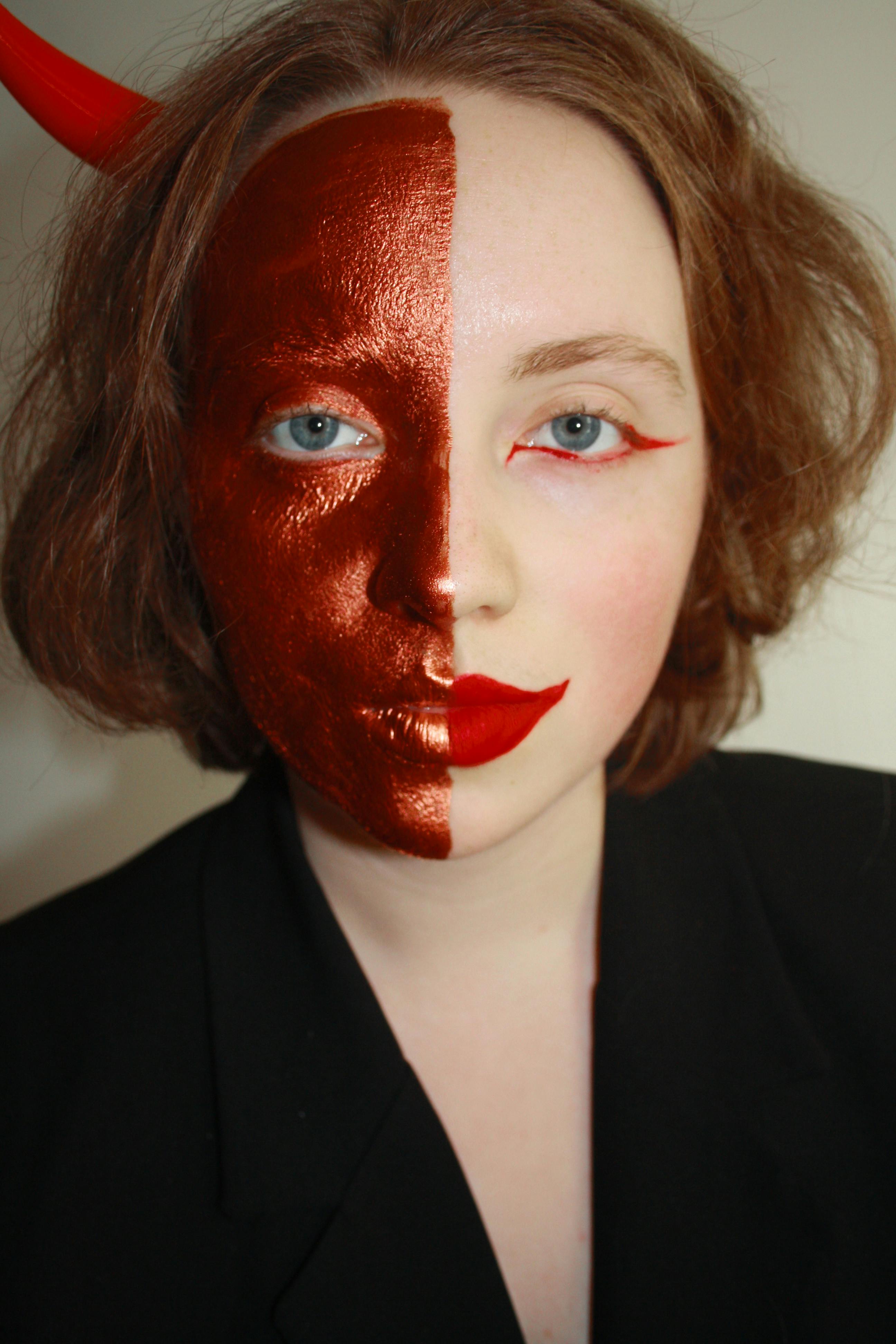 Woman with Painted Face as Devil for Halloween · Free Stock Photo