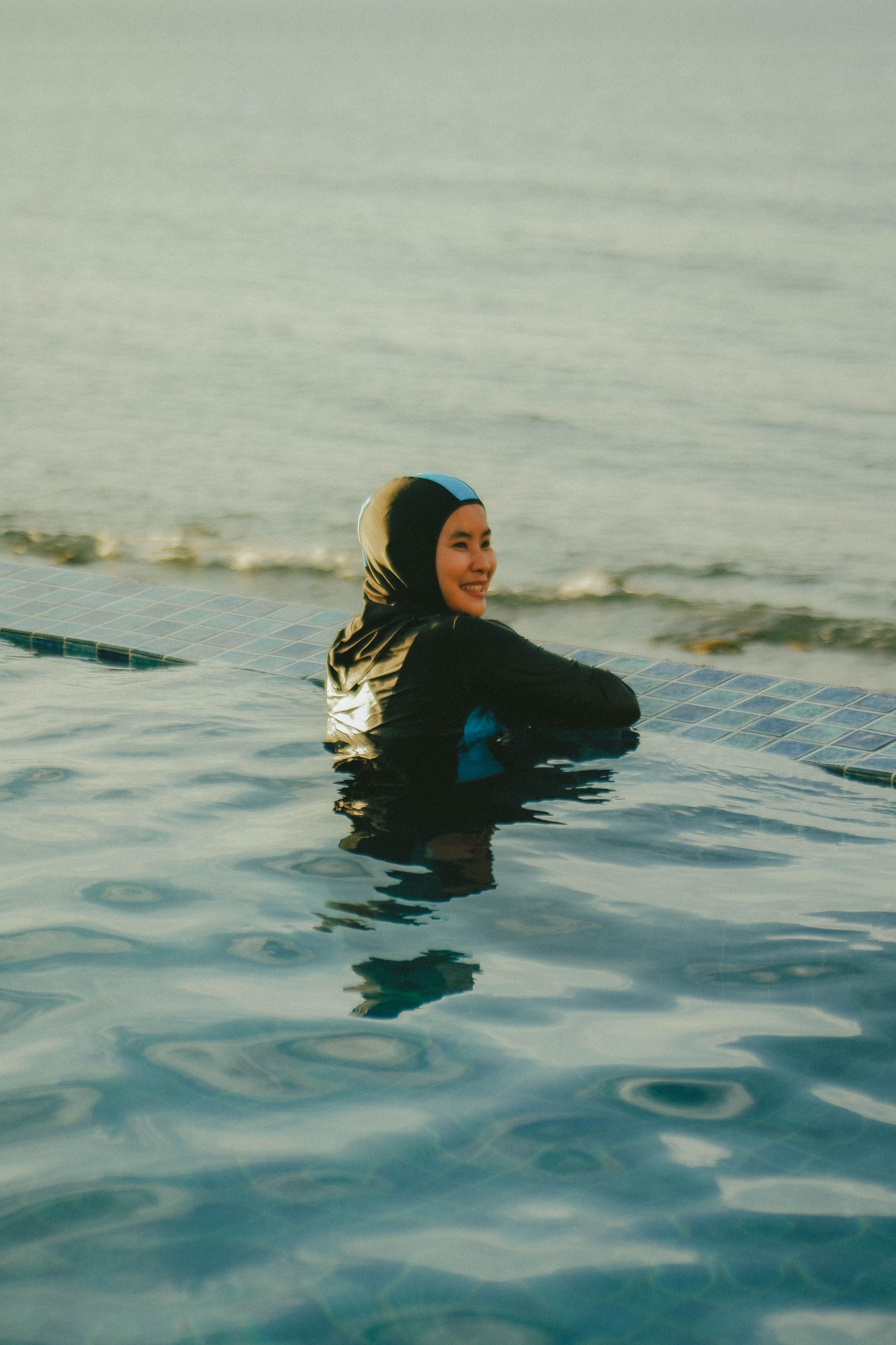 Asian woman swimming in calm water of river · Free Stock Photo
