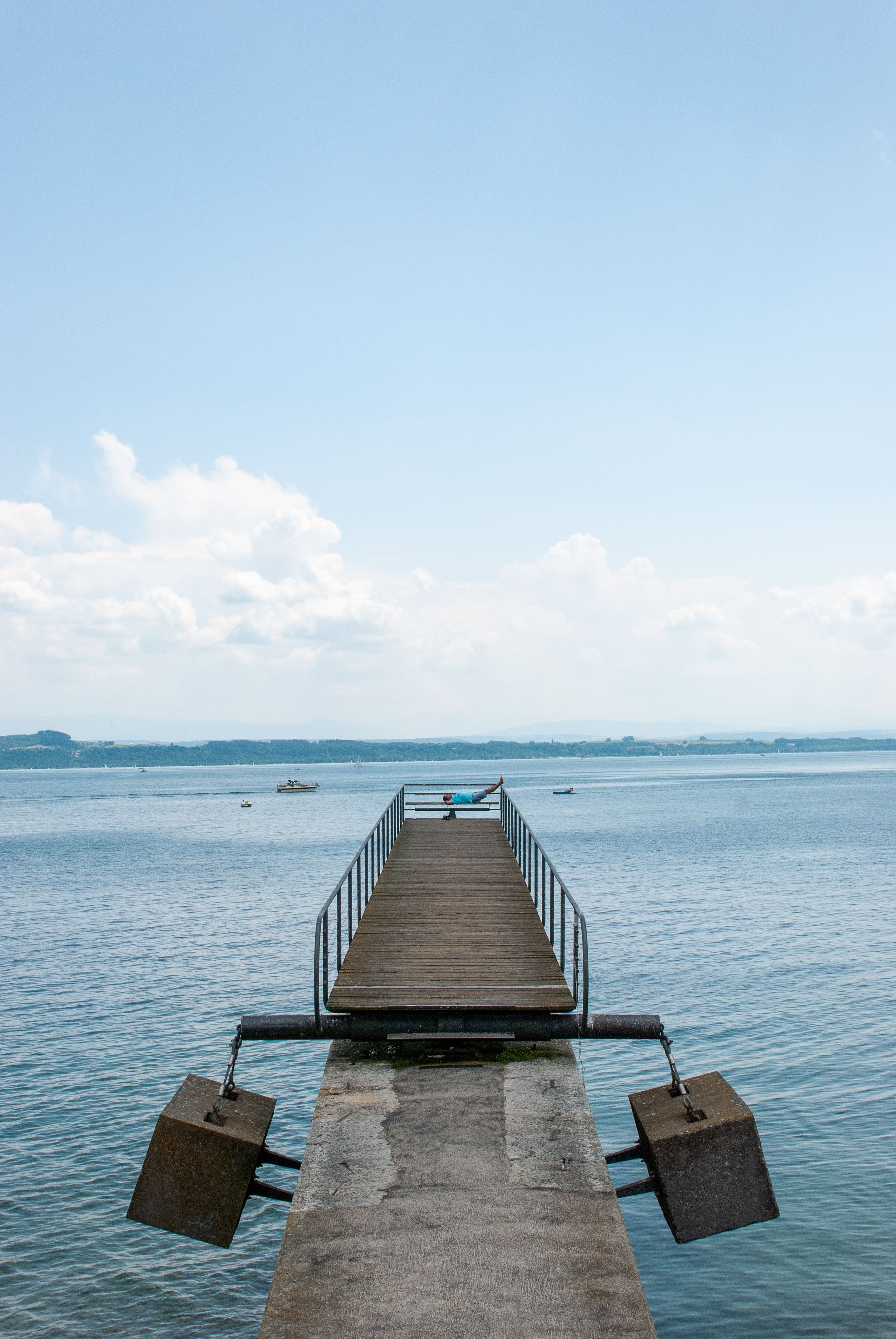 Top View of a Person Standing on a Pier · Free Stock Photo