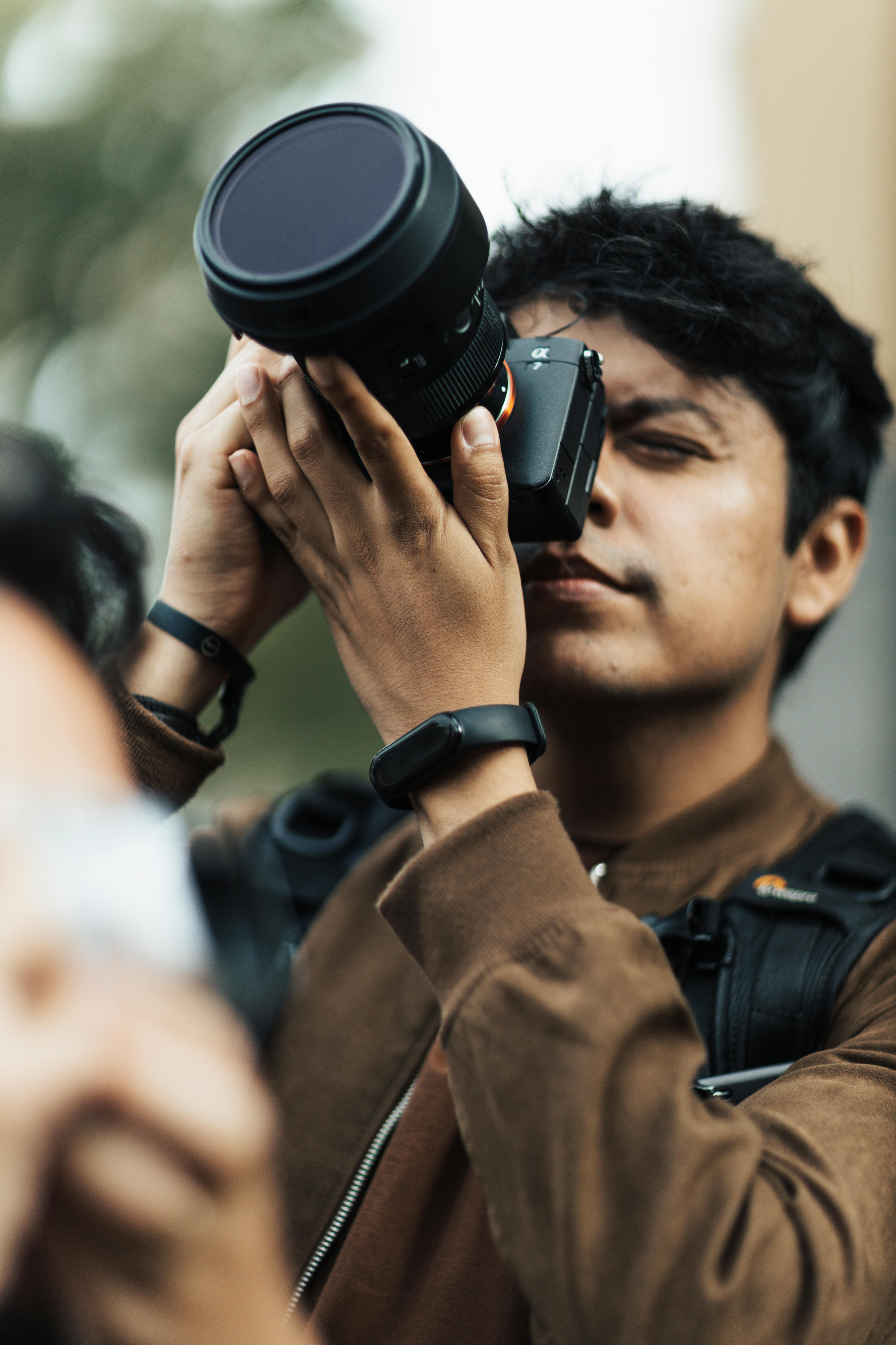 Portrait of Man Taking a Picture · Free Stock Photo