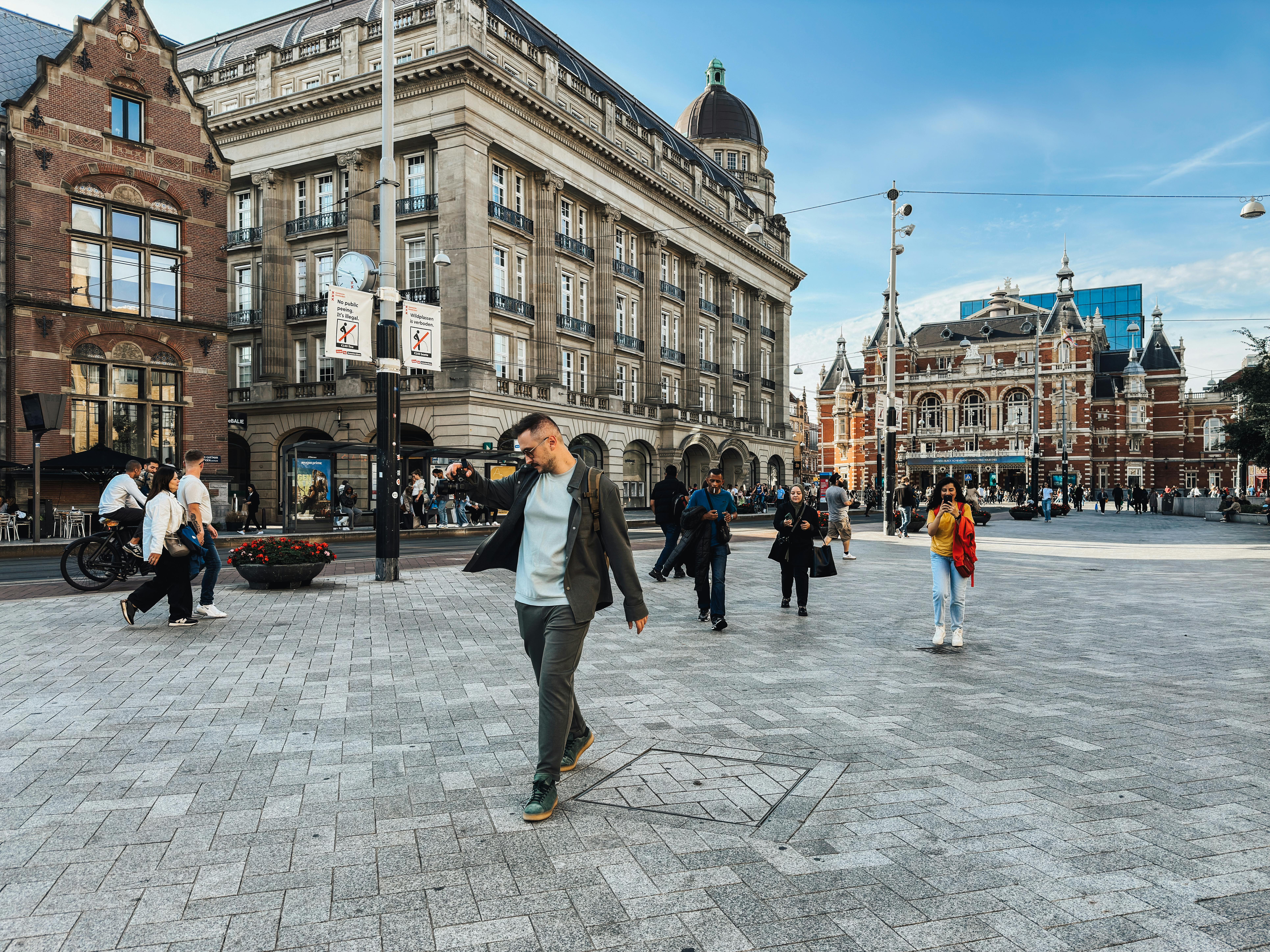 People Walking on a Town Square · Free Stock Photo