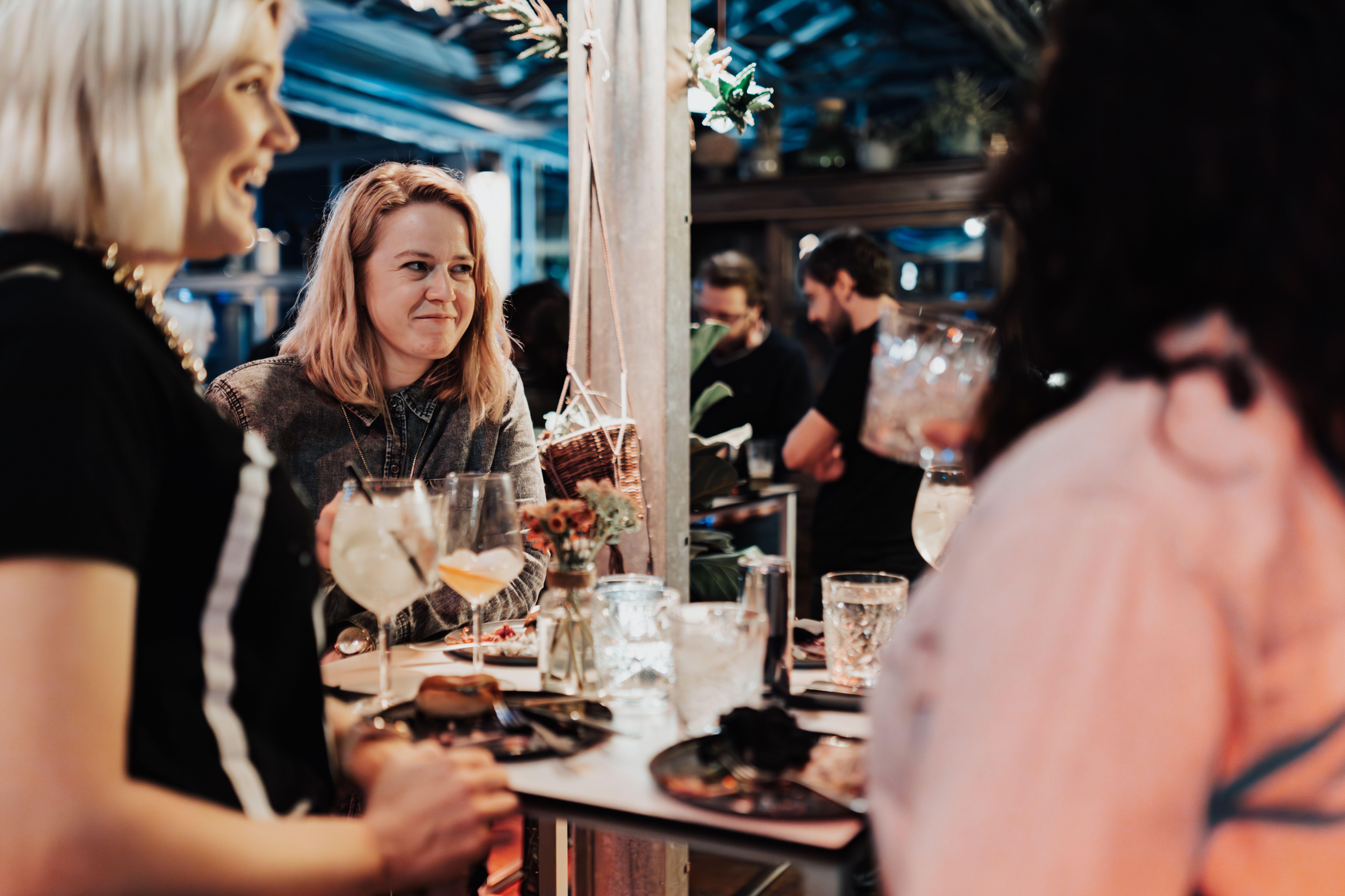 Group of People sitting at a Table during a Party · Free Stock Photo