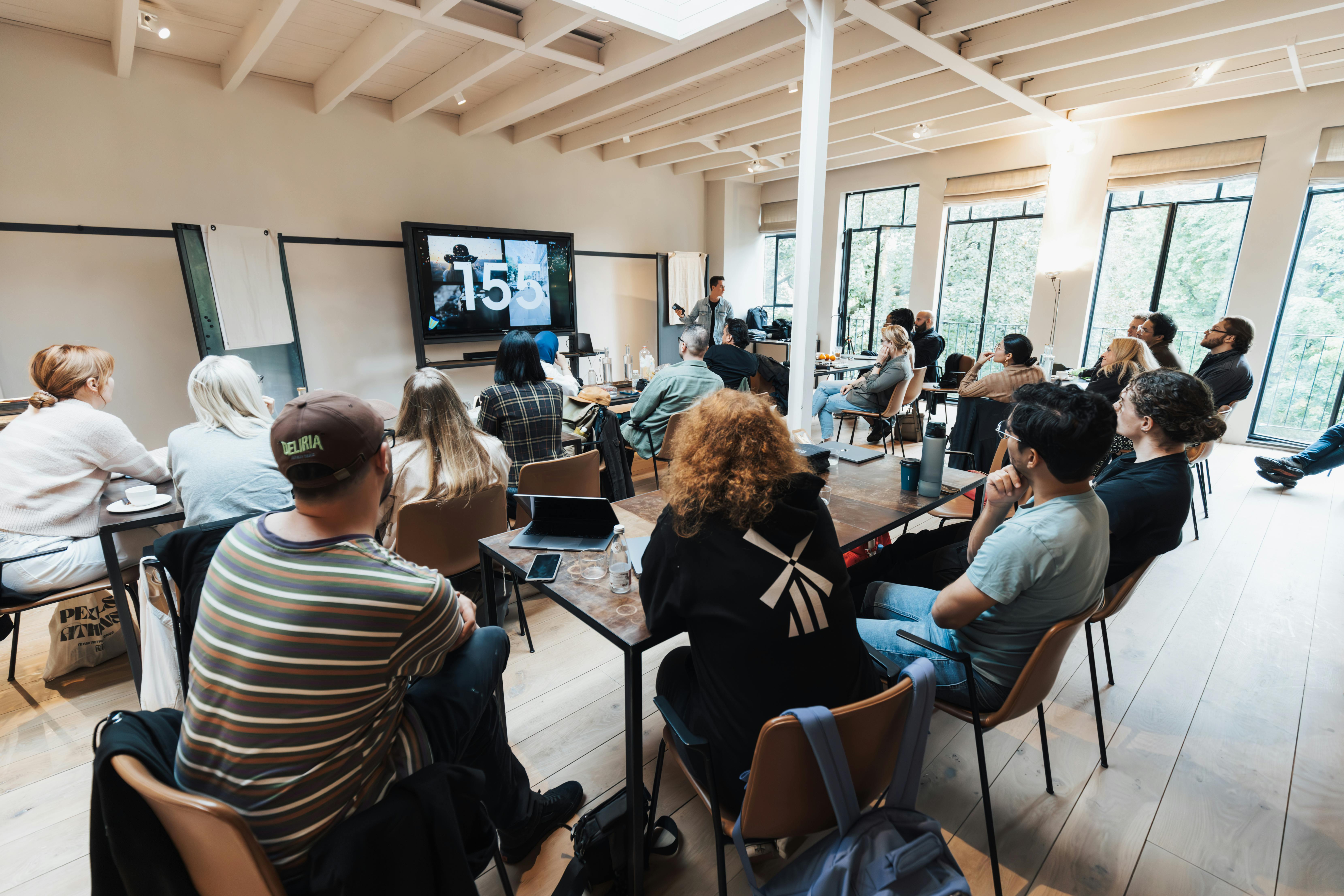 Group of People Listening Intently to a Presentation · Free Stock Photo