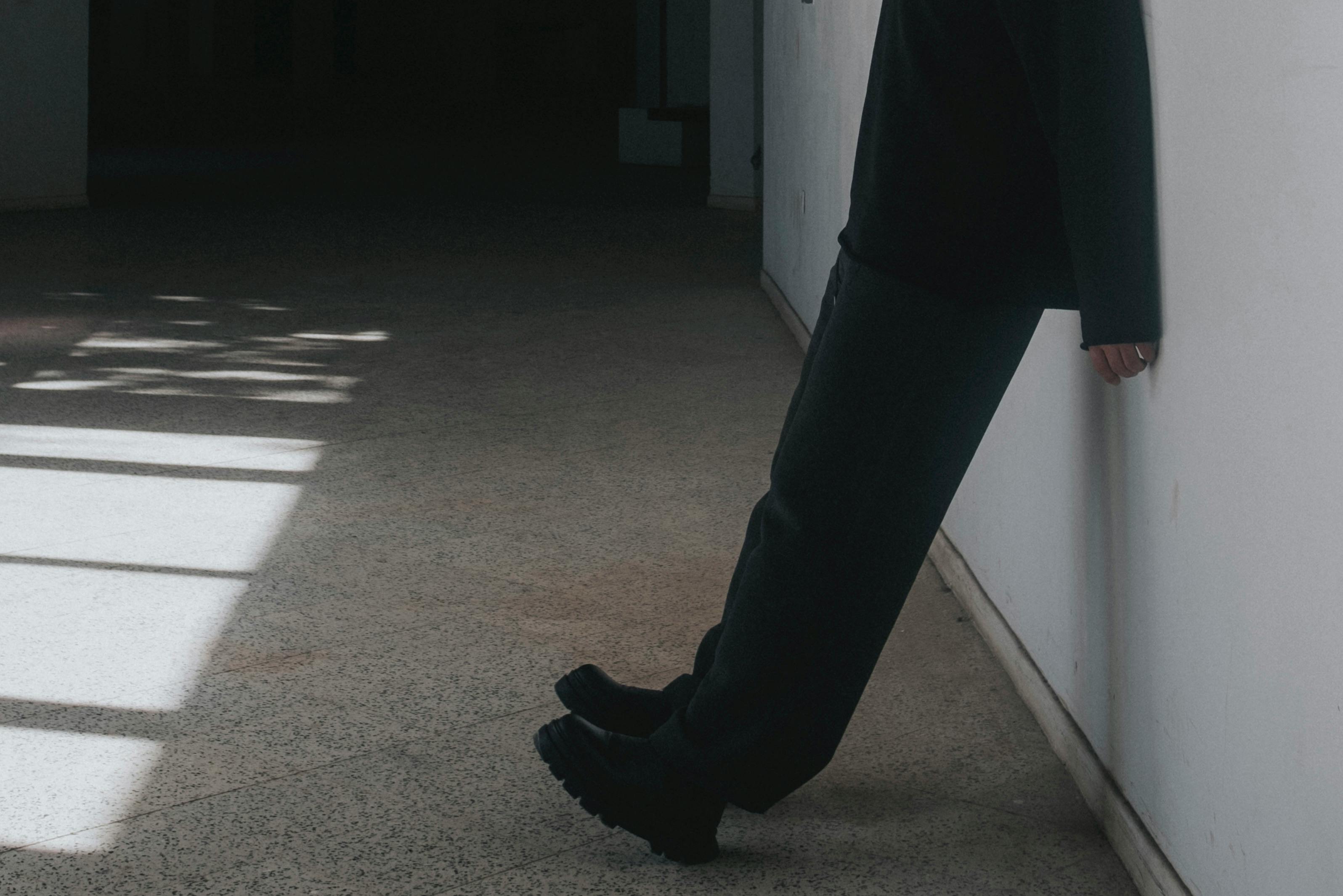 Person Leaning on a Wall · Free Stock Photo