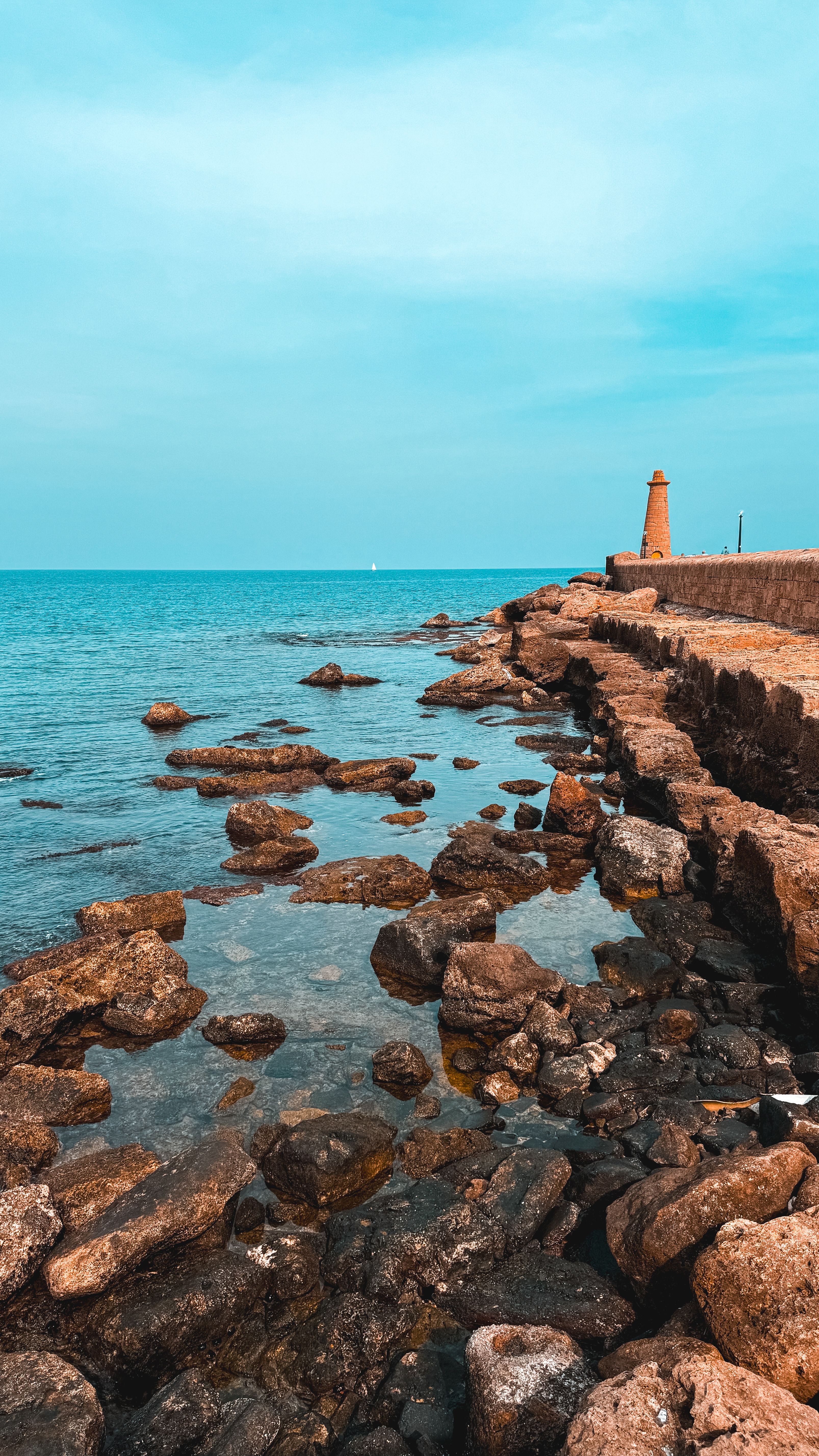 View of Lighthouse at End of Causeway · Free Stock Photo