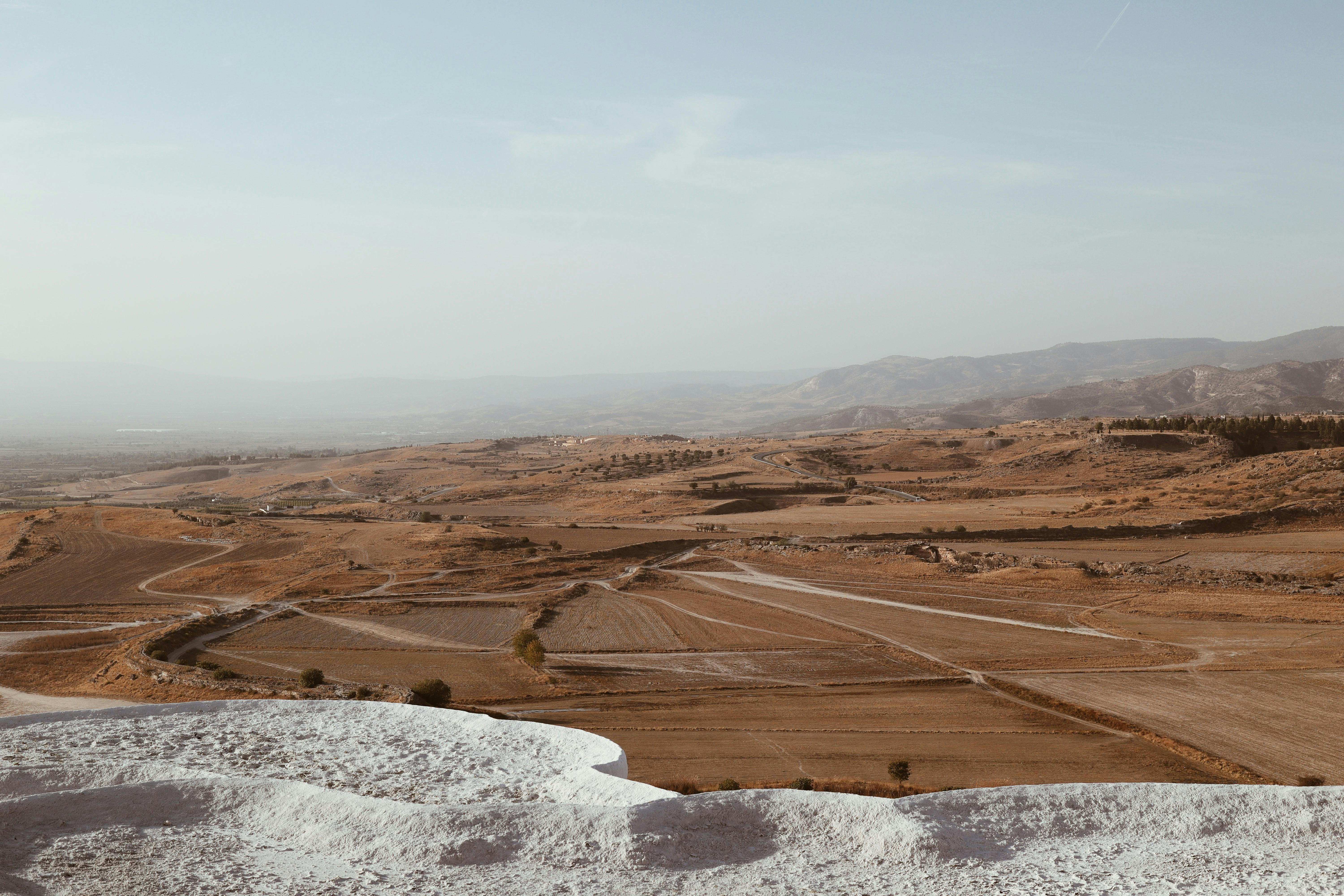 View of an Arid Plain from Rocky Promontory · Free Stock Photo