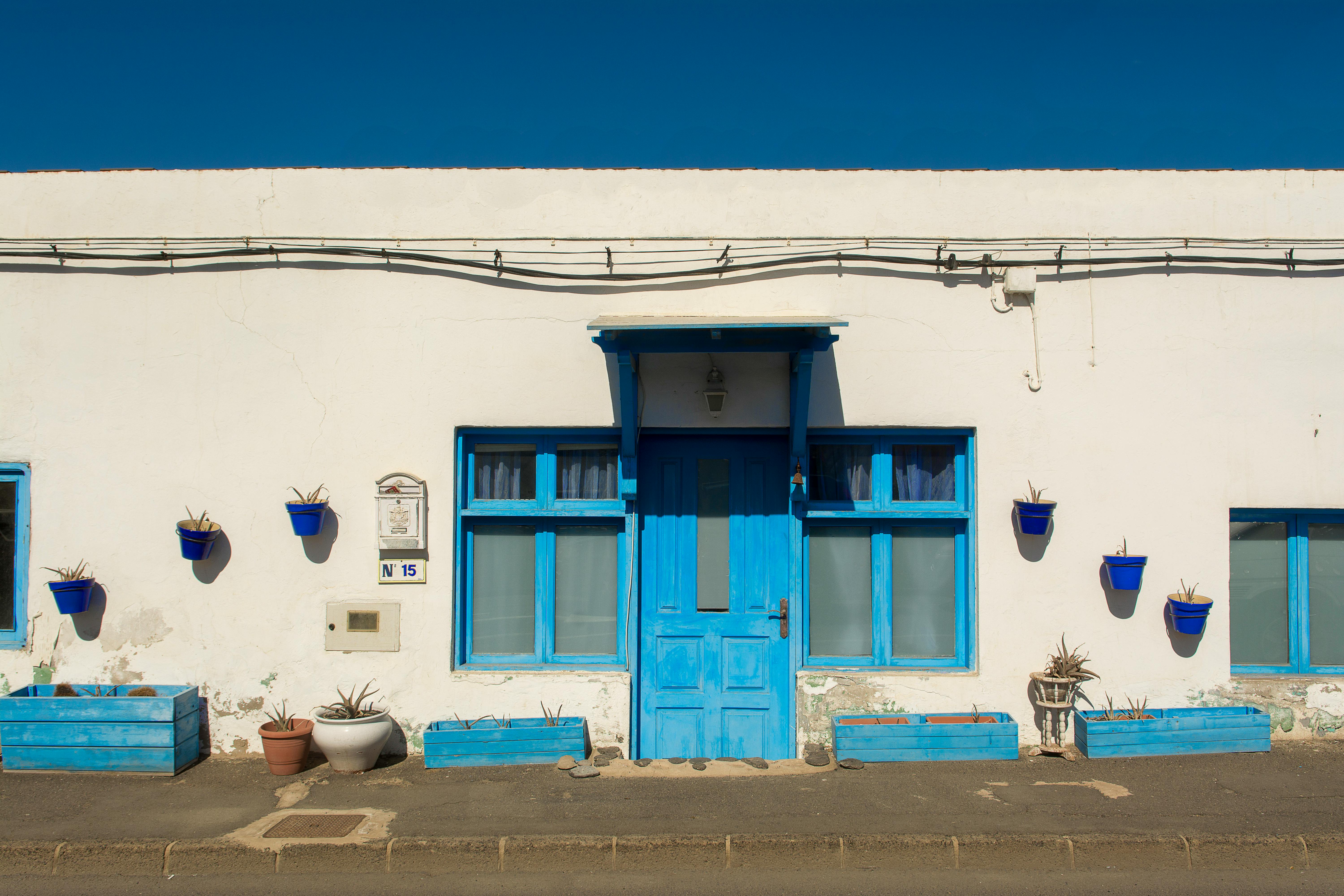 Single Story Building with Blue Doors and Windows · Free Stock Photo