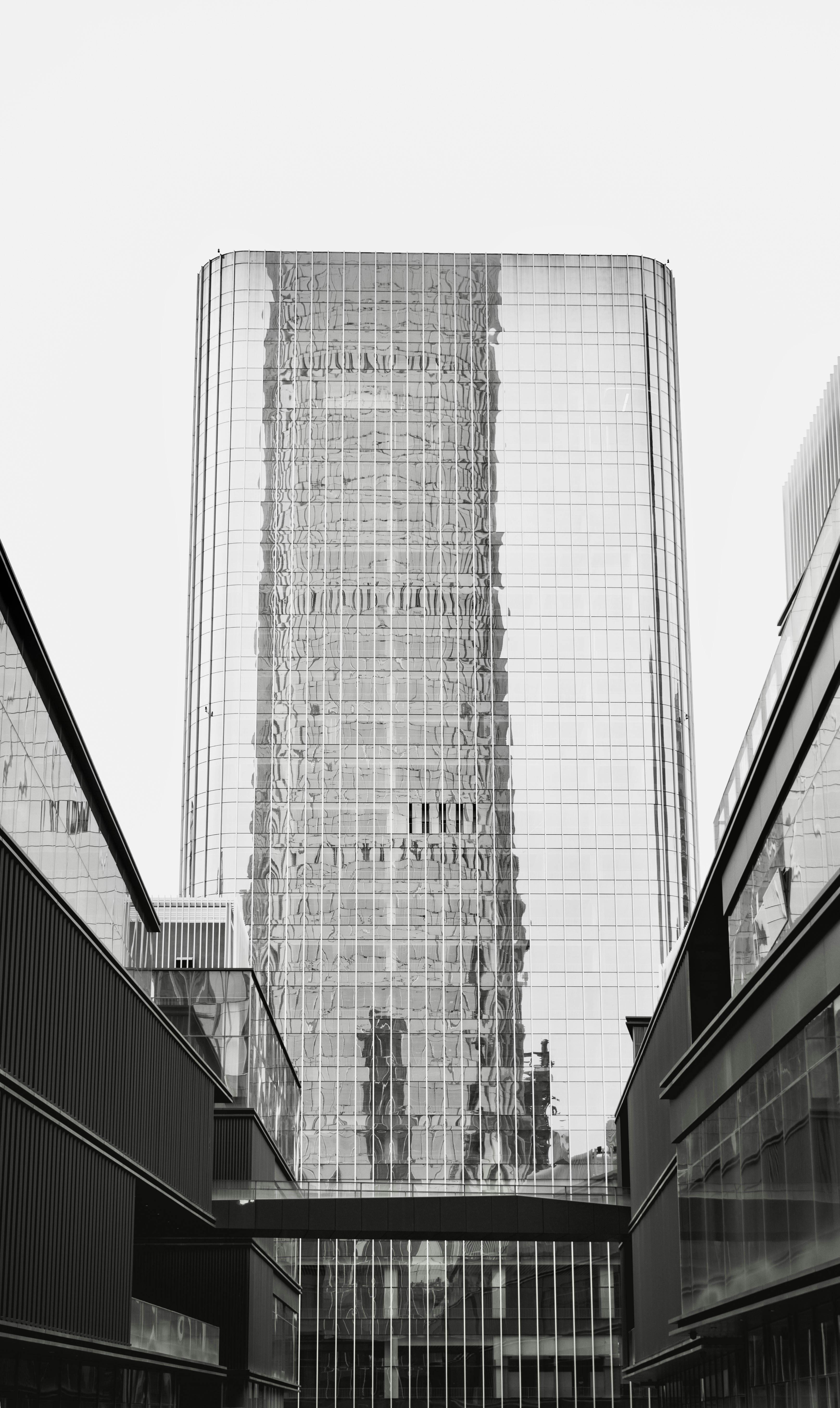 Grayscale Photo of a High Rise Building · Free Stock Photo