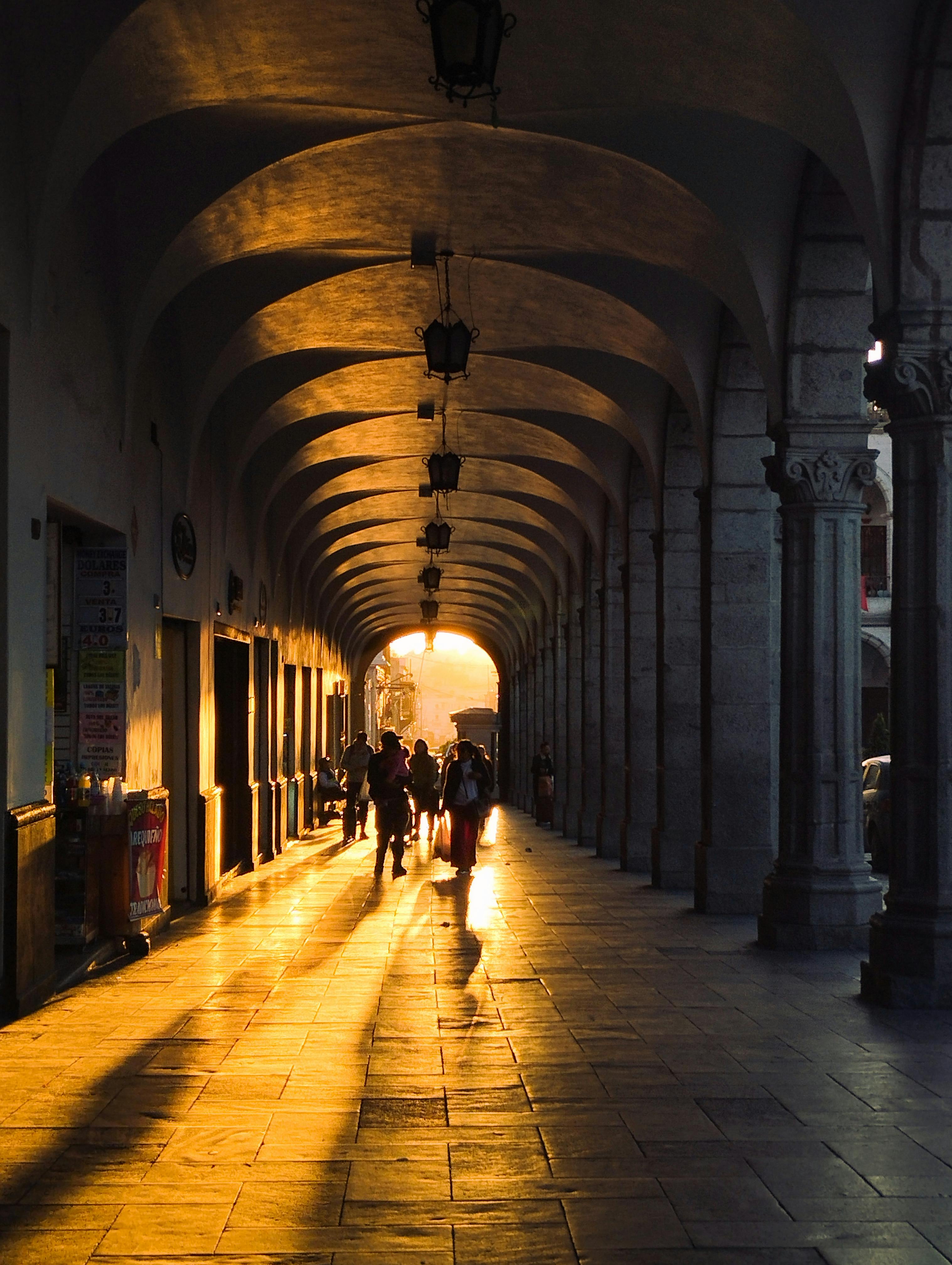 Sunlit Pavement by Building Colonnade · Free Stock Photo