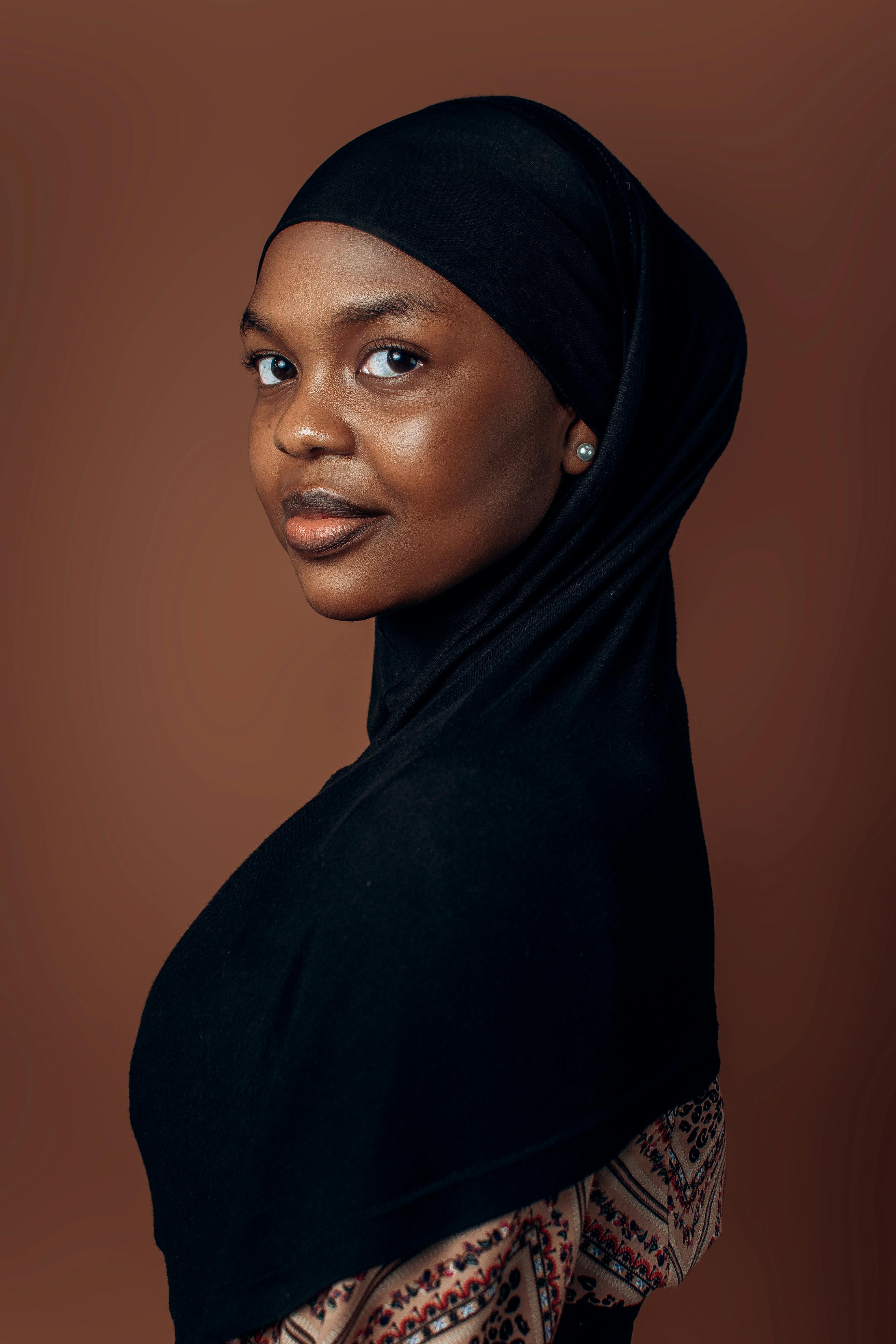 Girl in Hijab Posing near Wall · Free Stock Photo