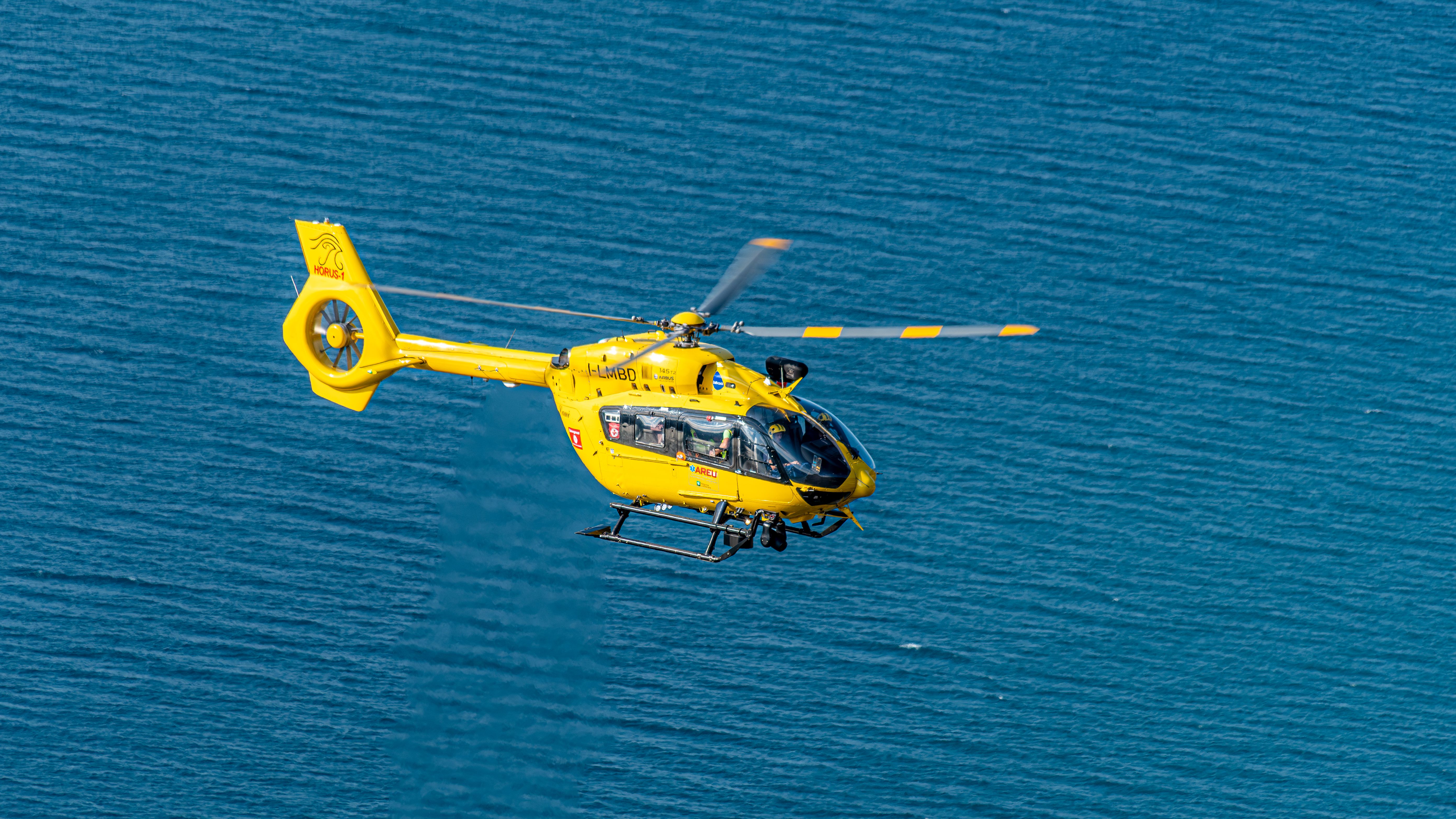 Helicopter Flying Above Sea · Free Stock Photo