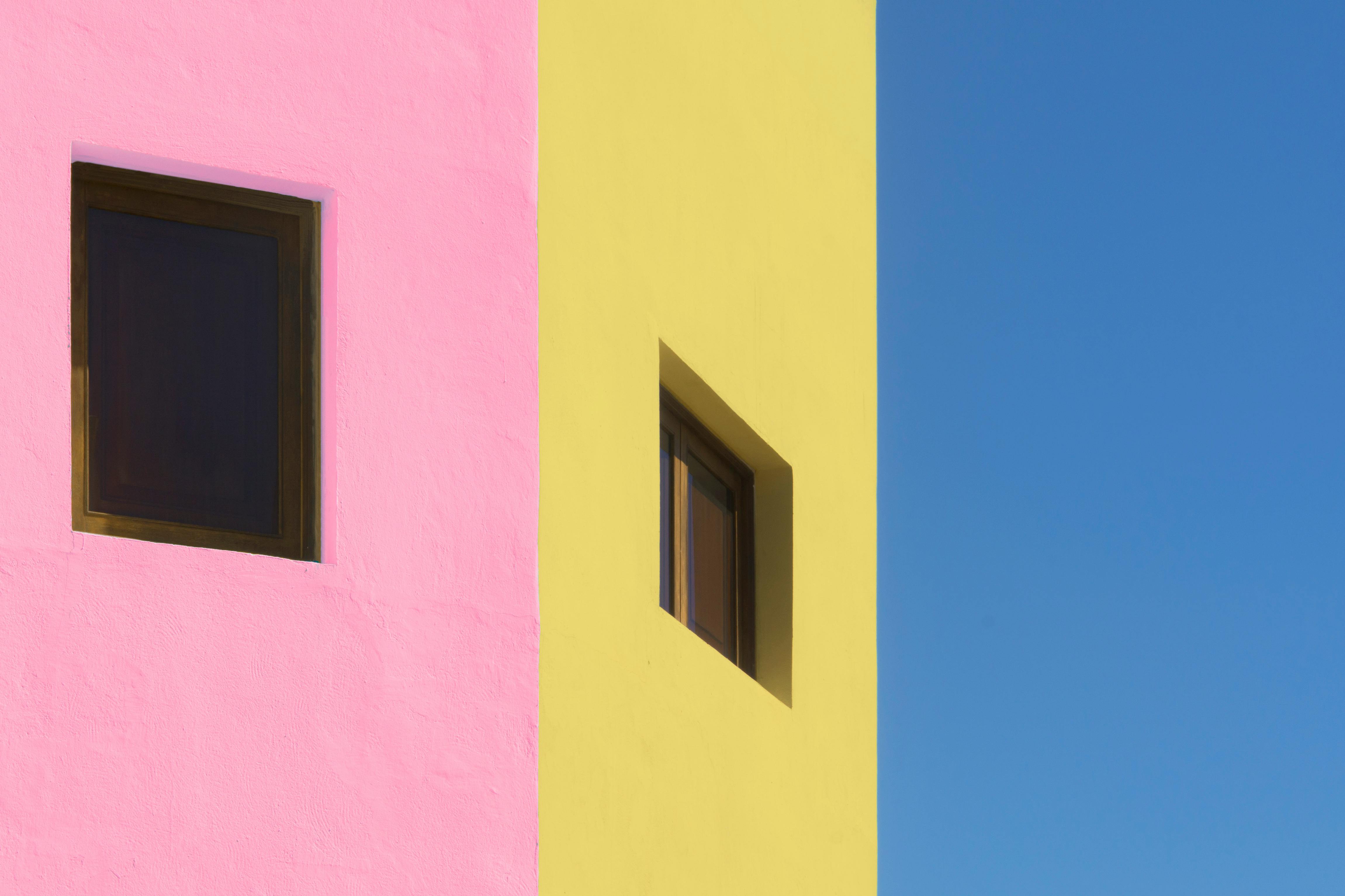 Yellow and Pink Facade with Windows · Free Stock Photo