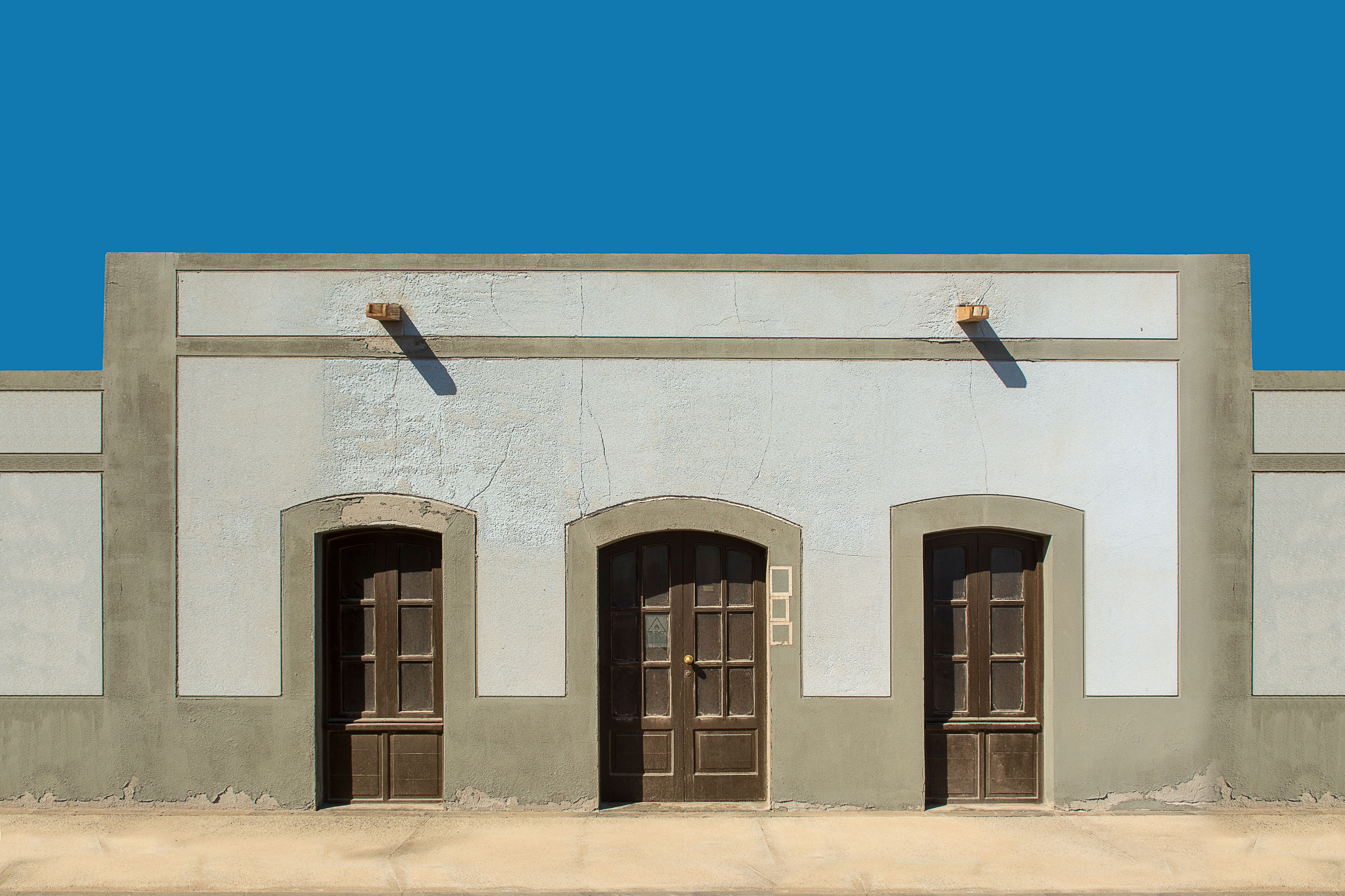 Facade with Three Wooden Doors · Free Stock Photo