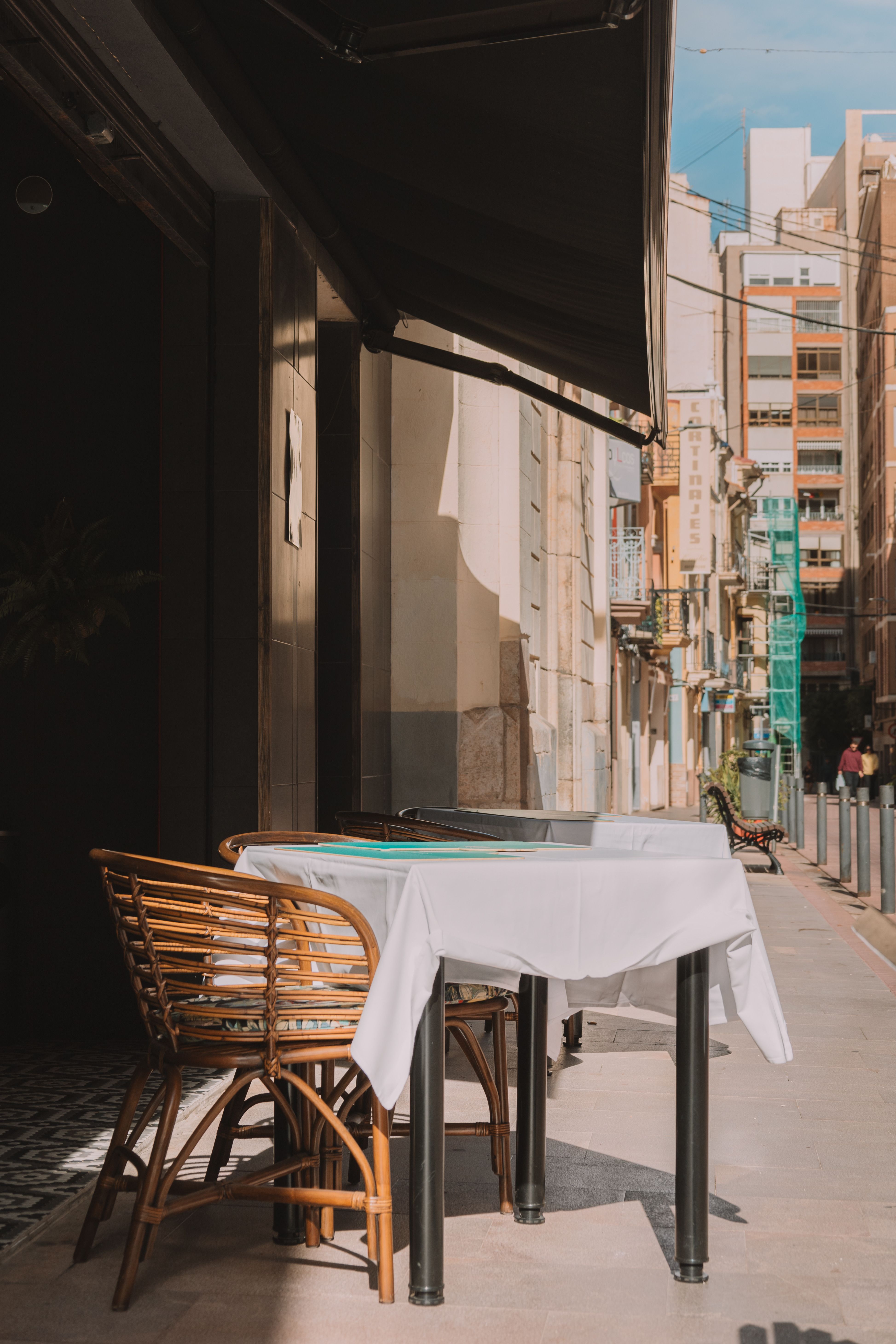 Outside Table in Restaurant on City Side-Street · Free Stock Photo