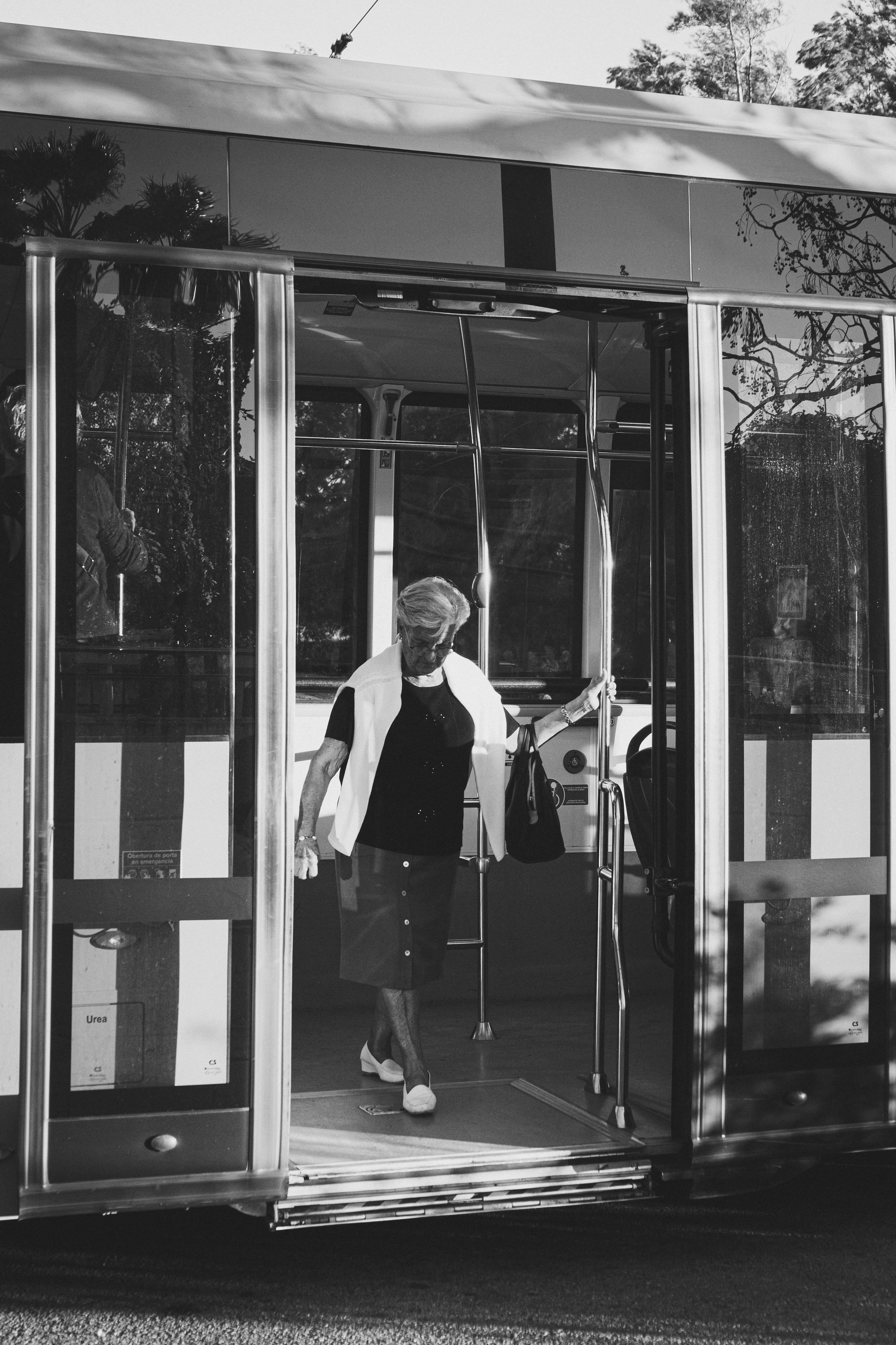 Woman Exiting Bus · Free Stock Photo