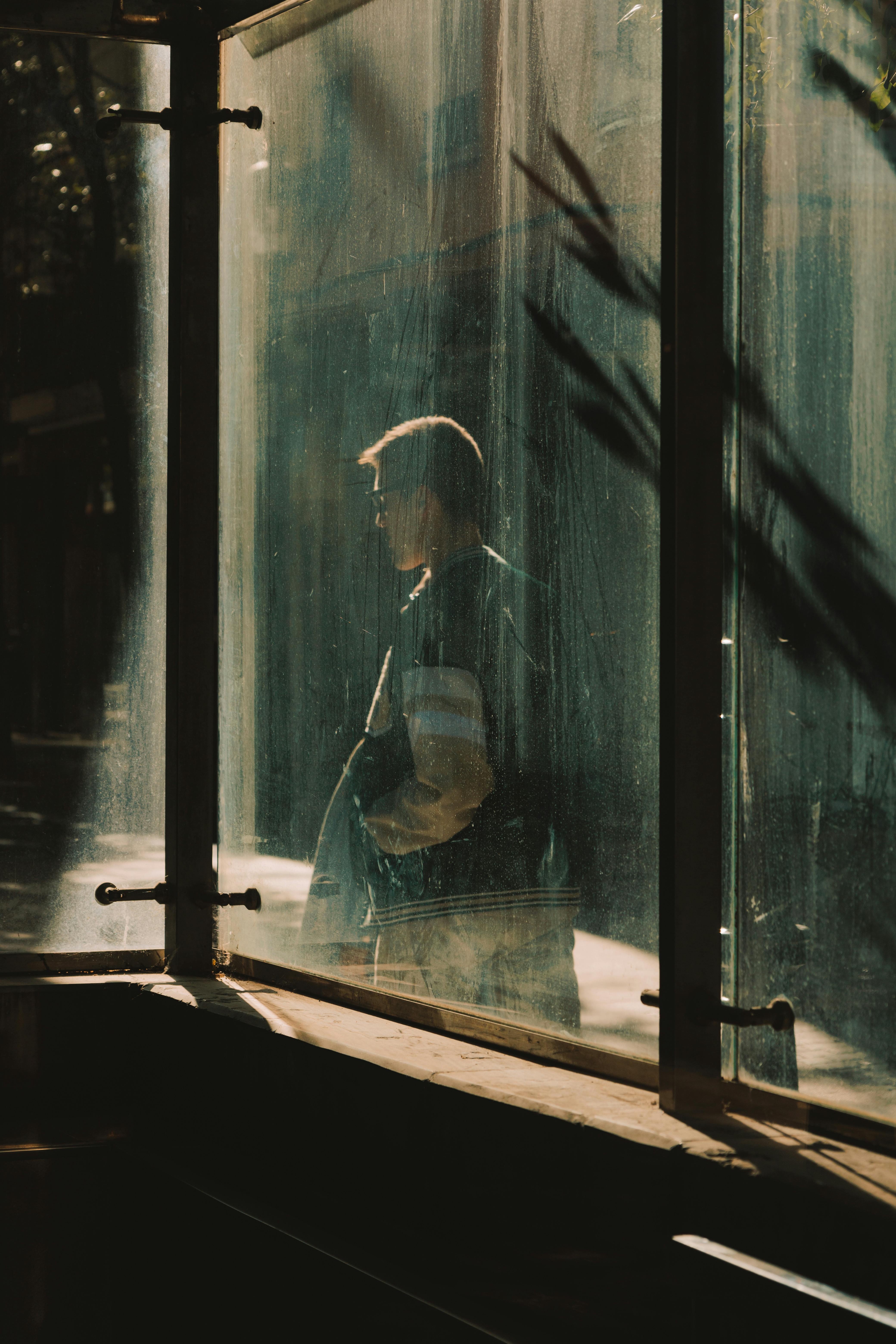 Walking on Street Man Seen through Dirty Window · Free Stock Photo