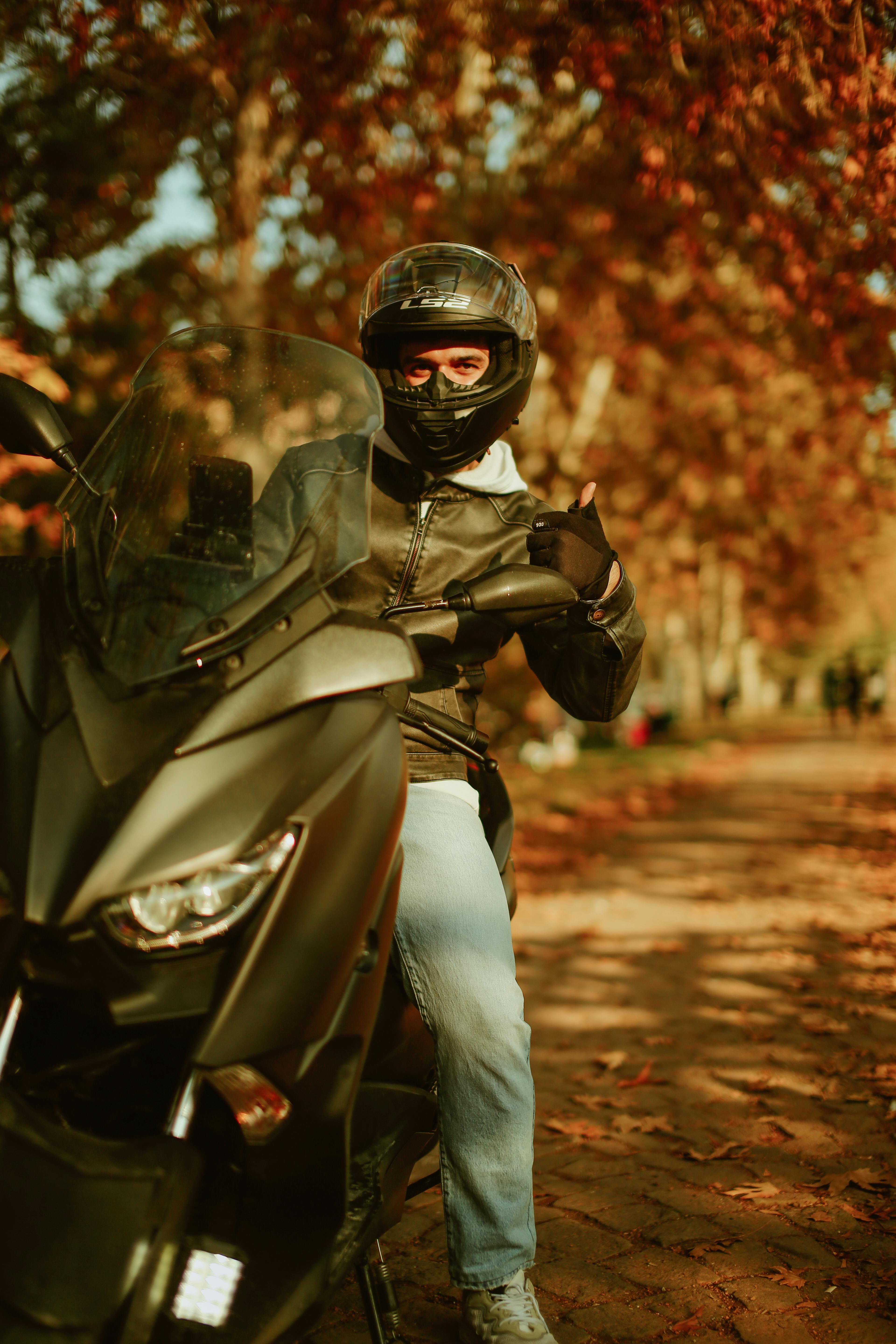 Biker Riding a Motorcycle on the Country Road · Free Stock Photo