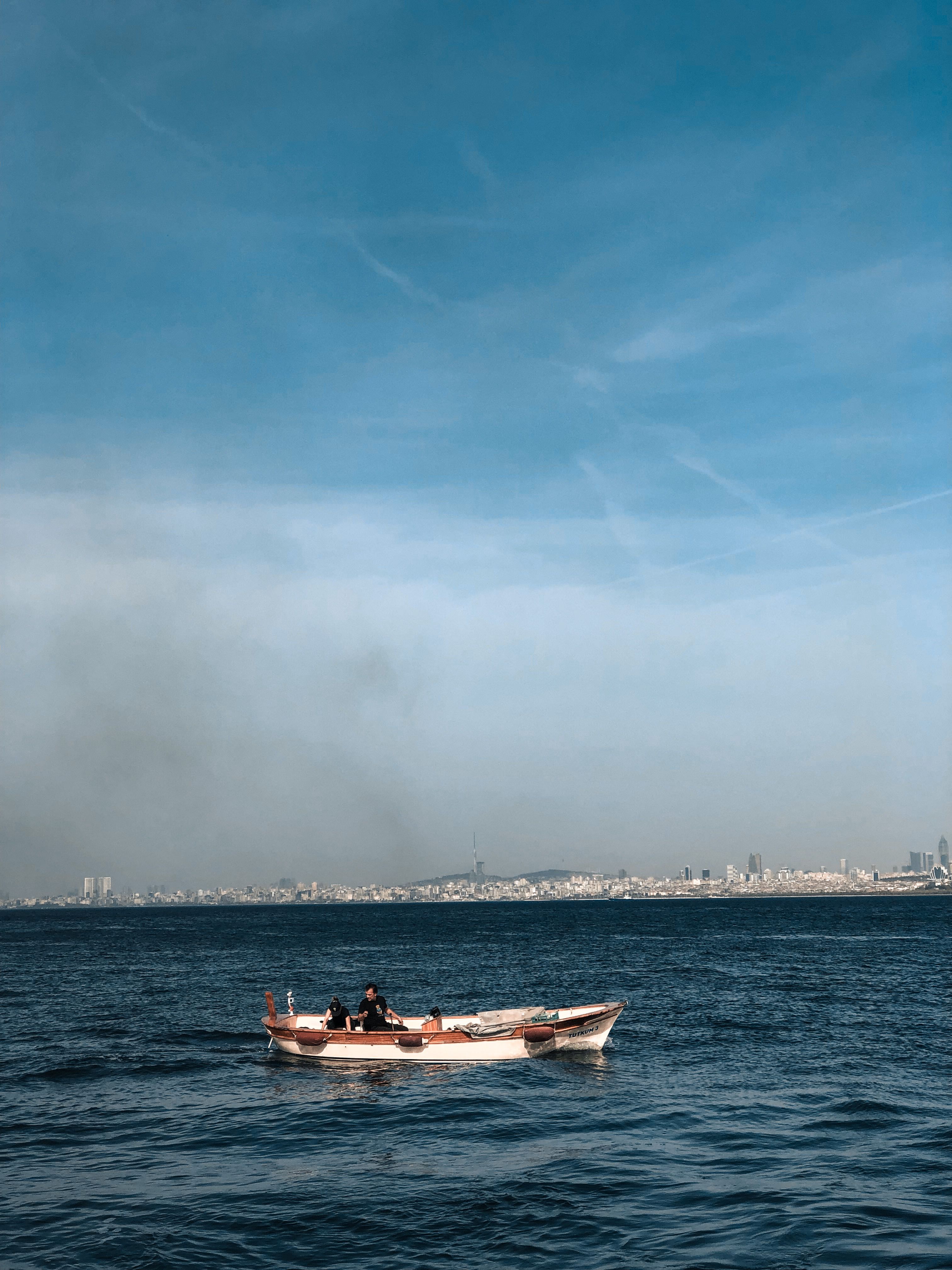 Man on Boat on Ocean · Free Stock Photo