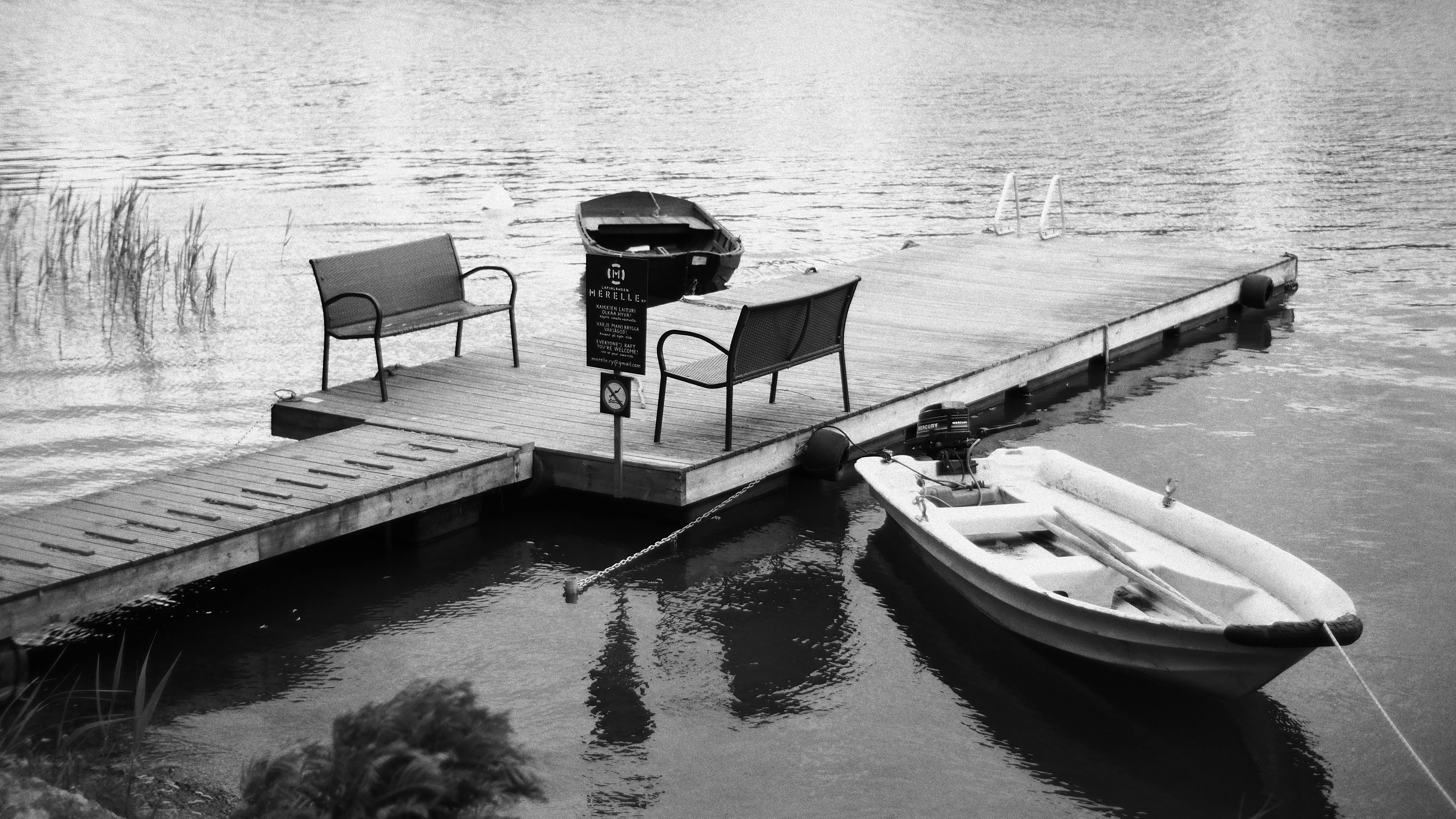 Boat Docked to a Wooden Pier with Benches · Free Stock Photo