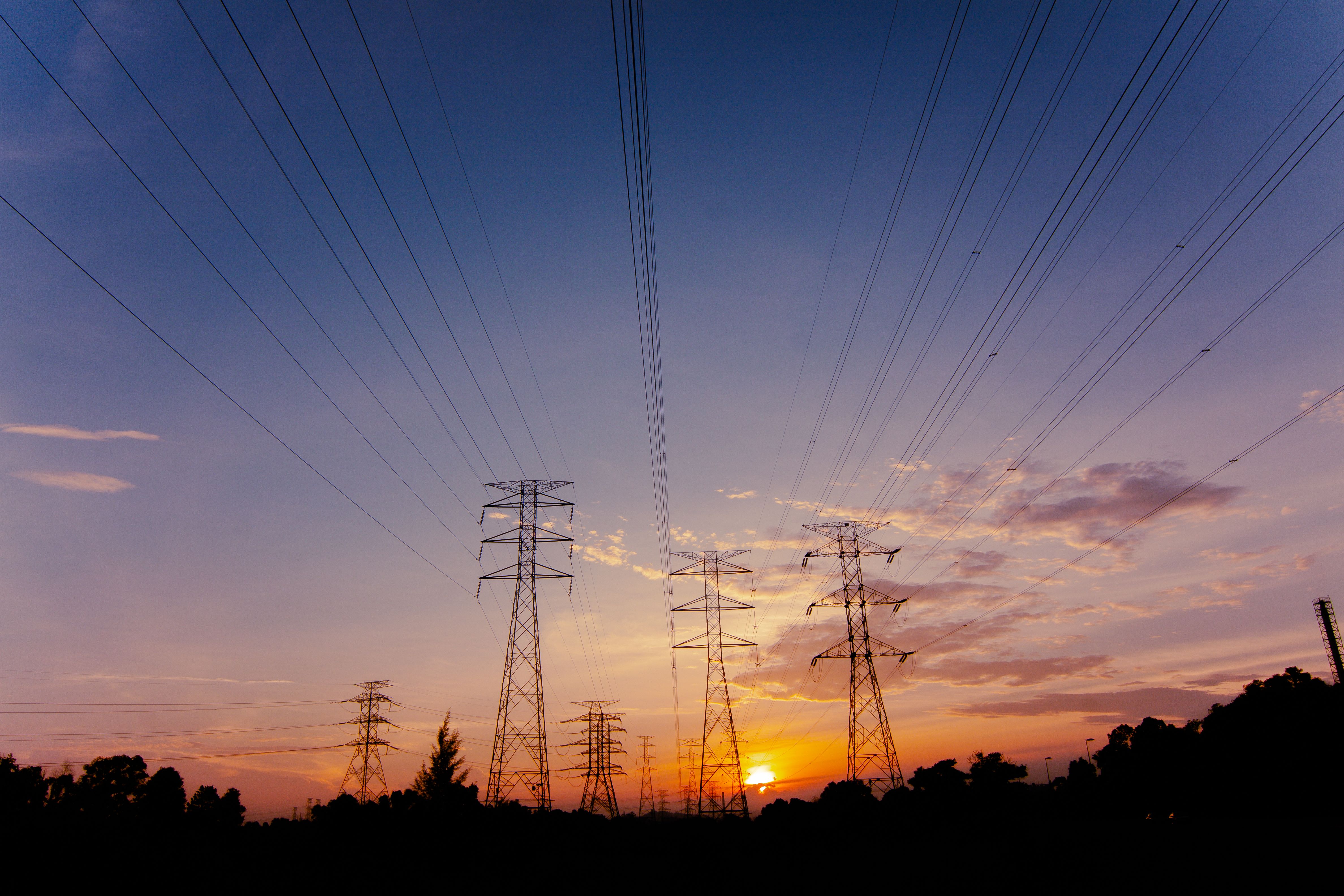 Transmission Towers at Sunset · Free Stock Photo