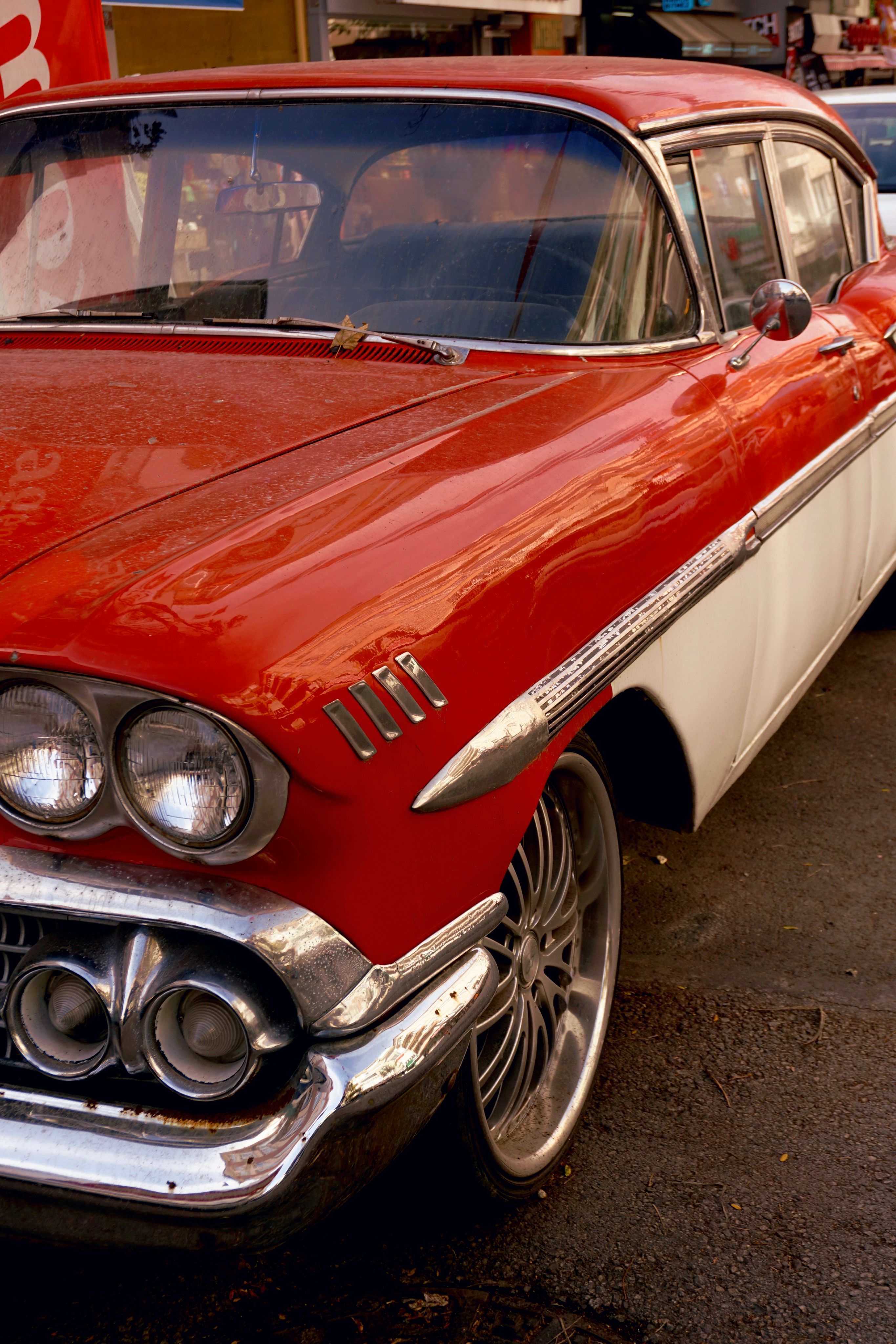 Red Vintage Car on a Street · Free Stock Photo