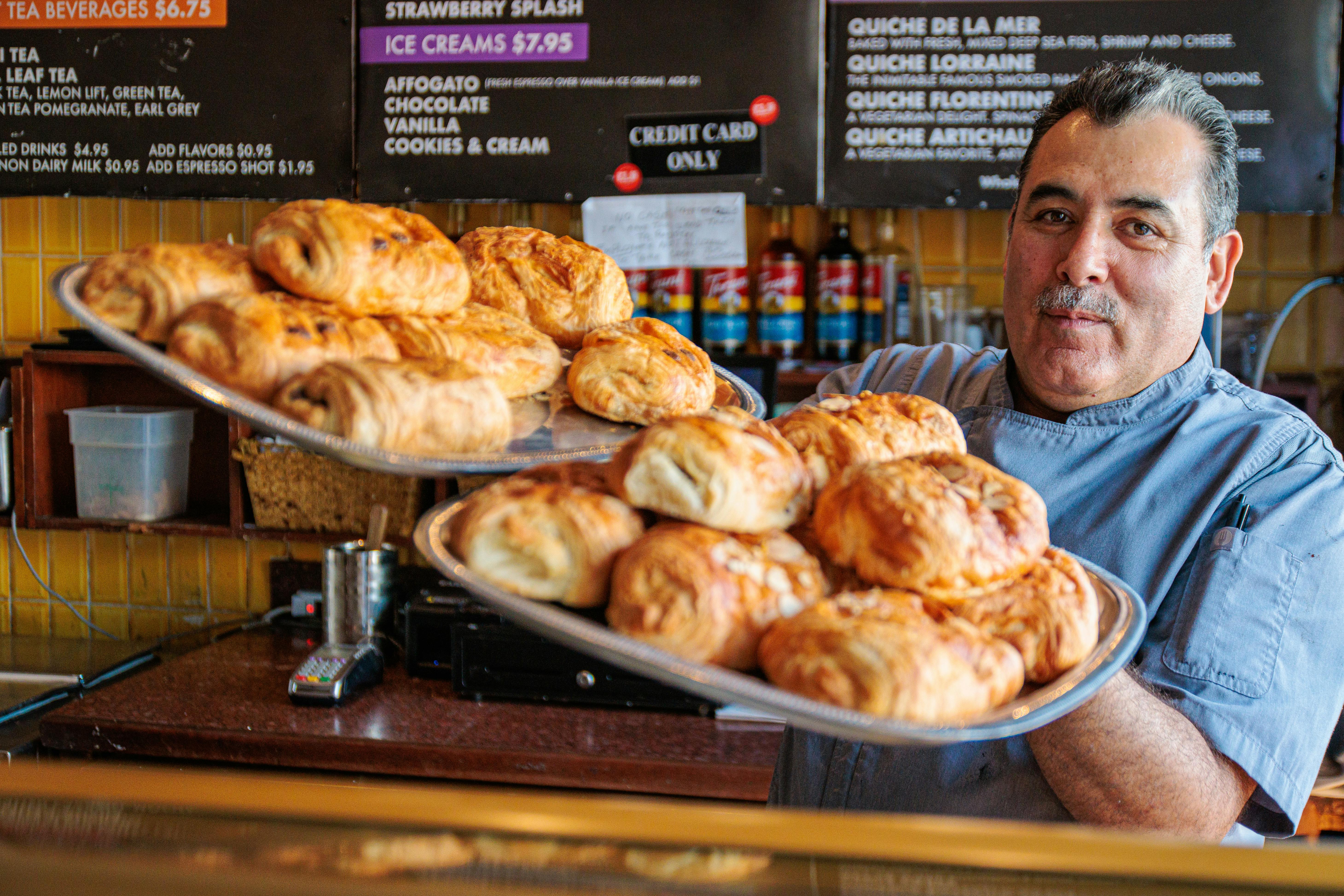 Portrait of Man with Sweet Bread Buns · Free Stock Photo