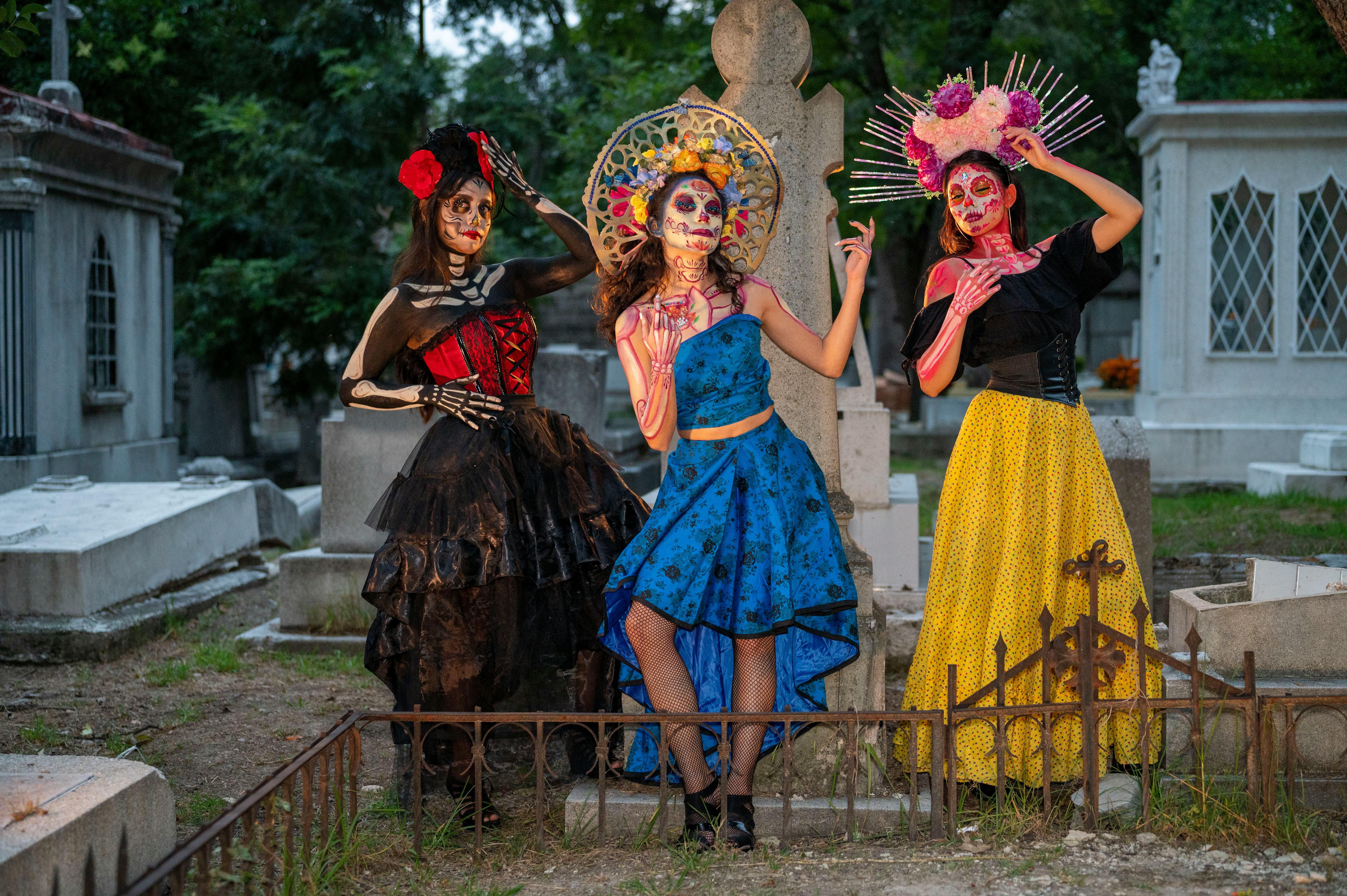 Three Catrinas Dancing in Cemetery · Free Stock Photo