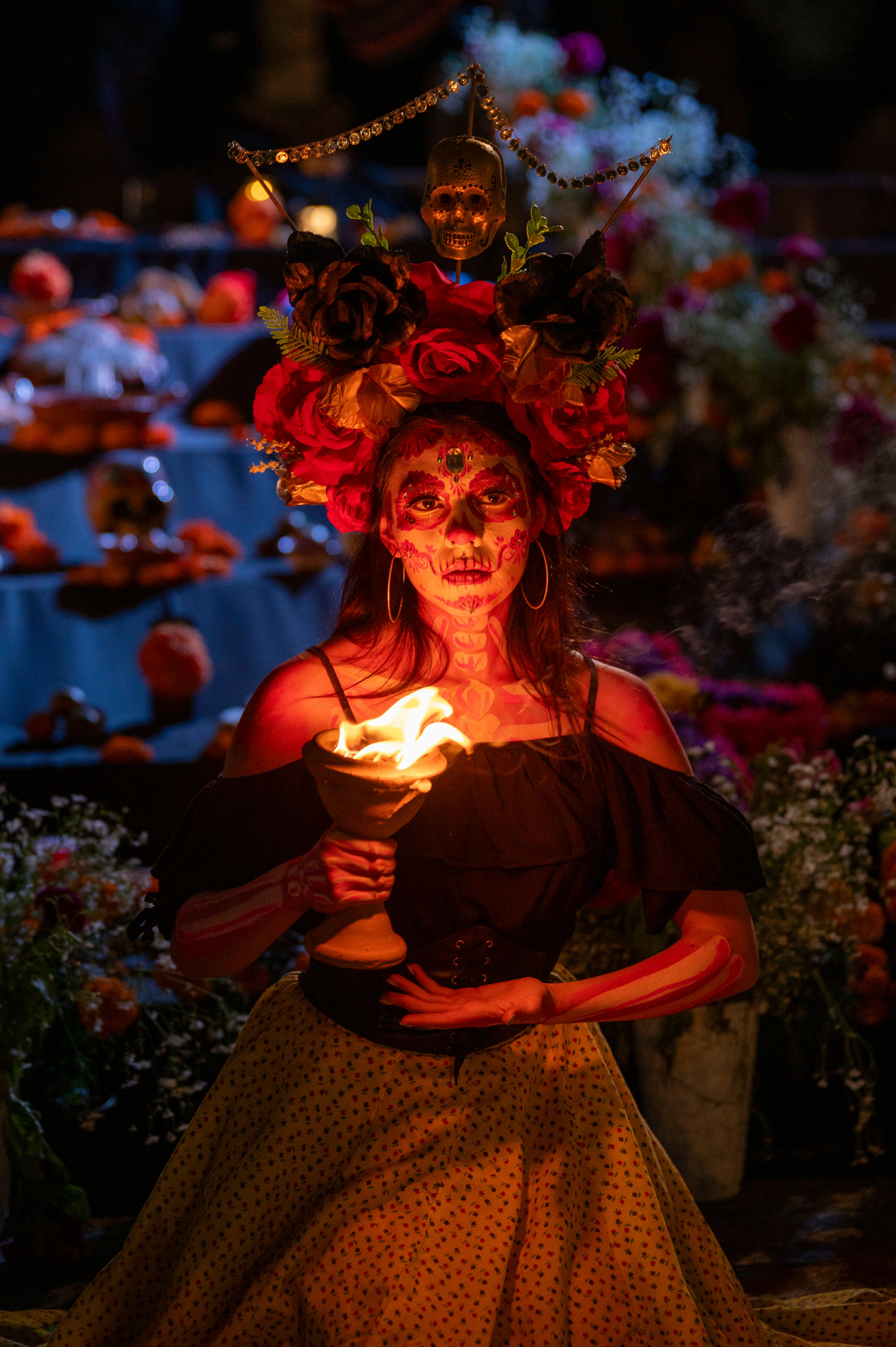 Portrait of Woman with Eyes Closed Holding Lit Torch · Free Stock Photo