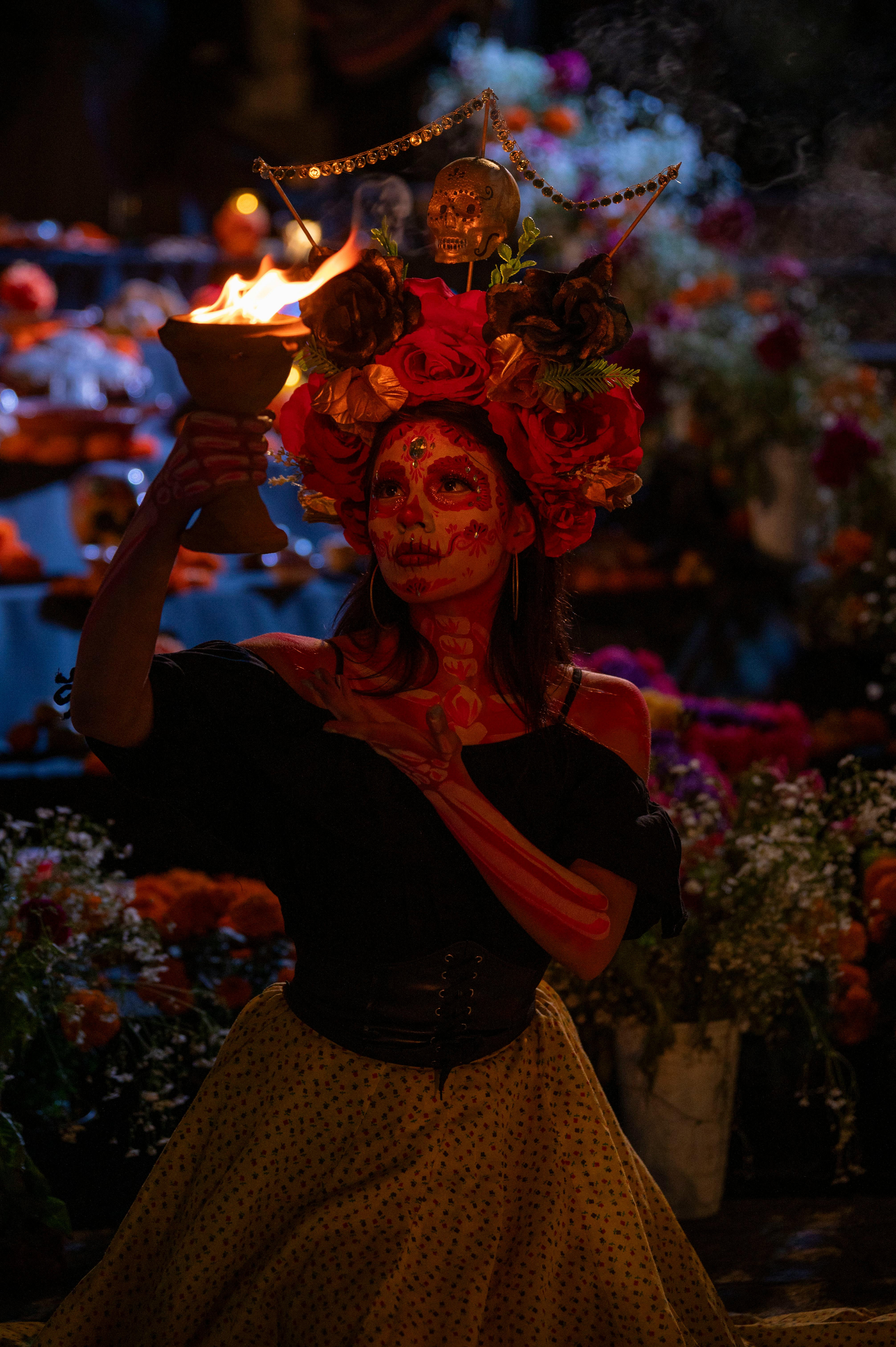 Catrina Dancing with Flaming Torch at Night · Free Stock Photo
