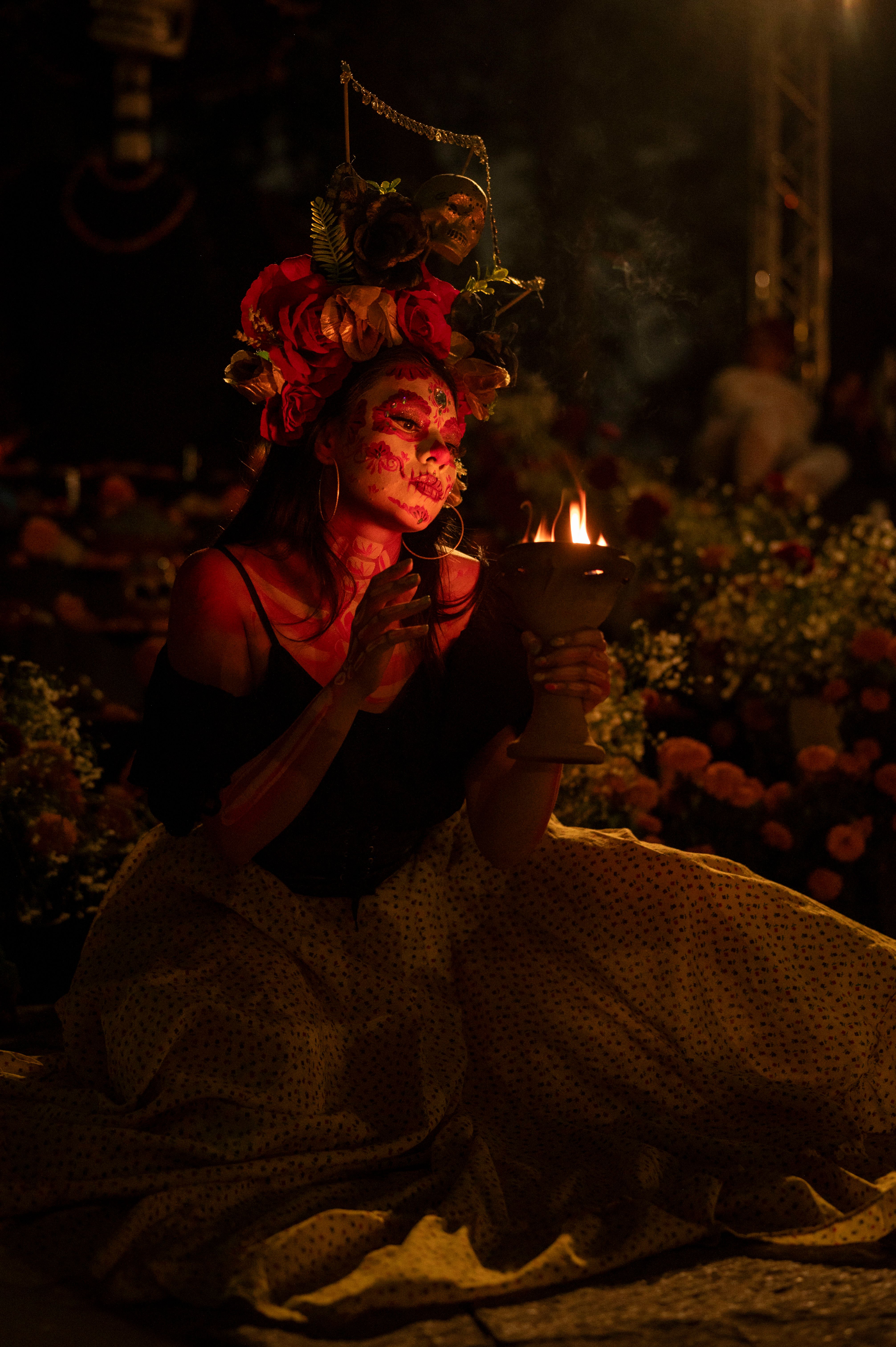 Catrina Sitting with Torch · Free Stock Photo