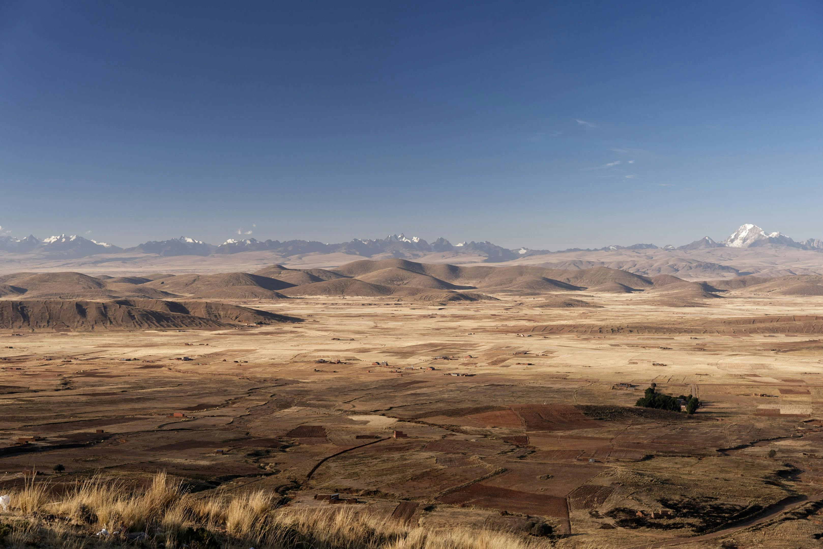 Panorama of a Valley Fields and Distant Mountain Ranges · Free Stock Photo